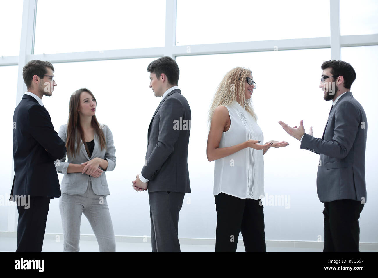 Business colleagues talk in a lobby hi-res stock photography and images ...