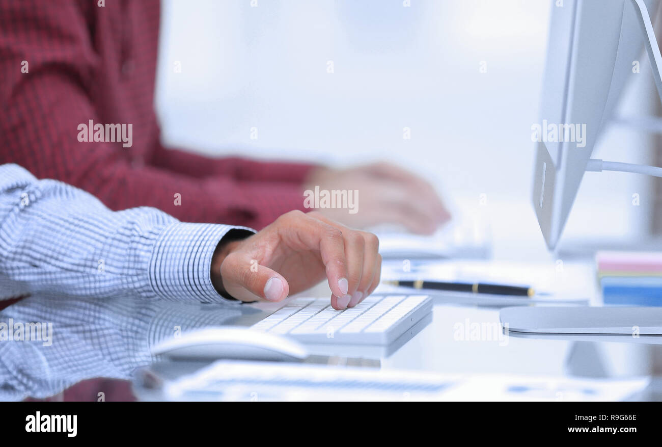 closeup of employees typing on the keyboard Stock Photo - Alamy