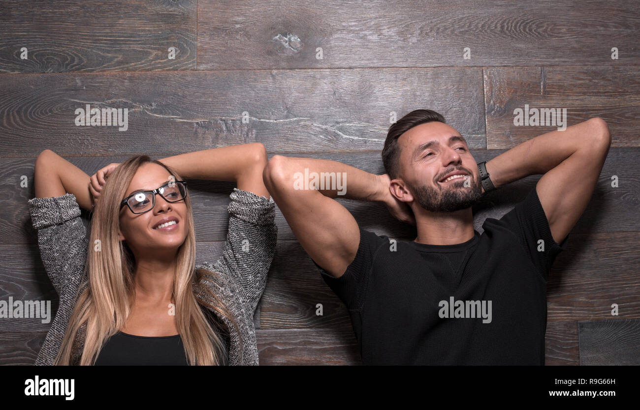 woman and man stand near the wall and gesture with their hands Stock ...