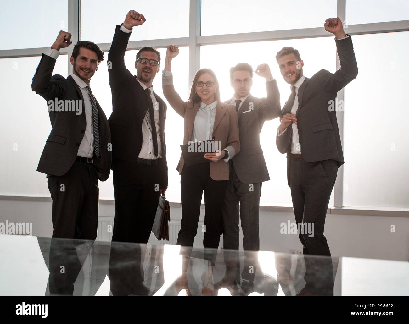 Business team celebrating a good job in the office Stock Photo - Alamy