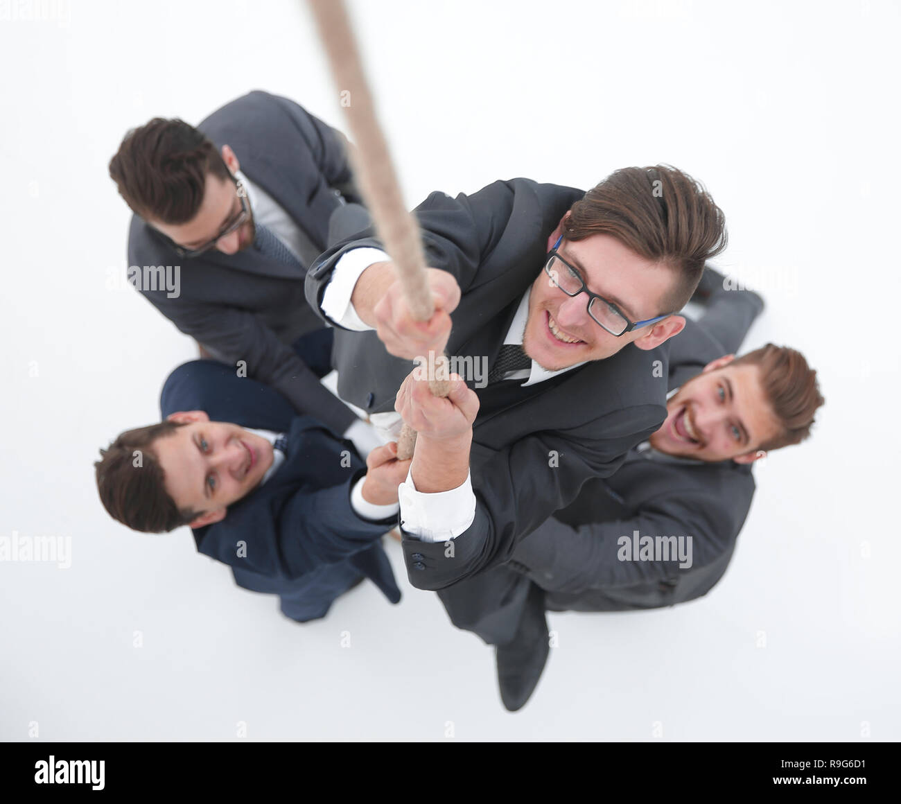 business team helping the leader to climb the rope Stock Photo - Alamy