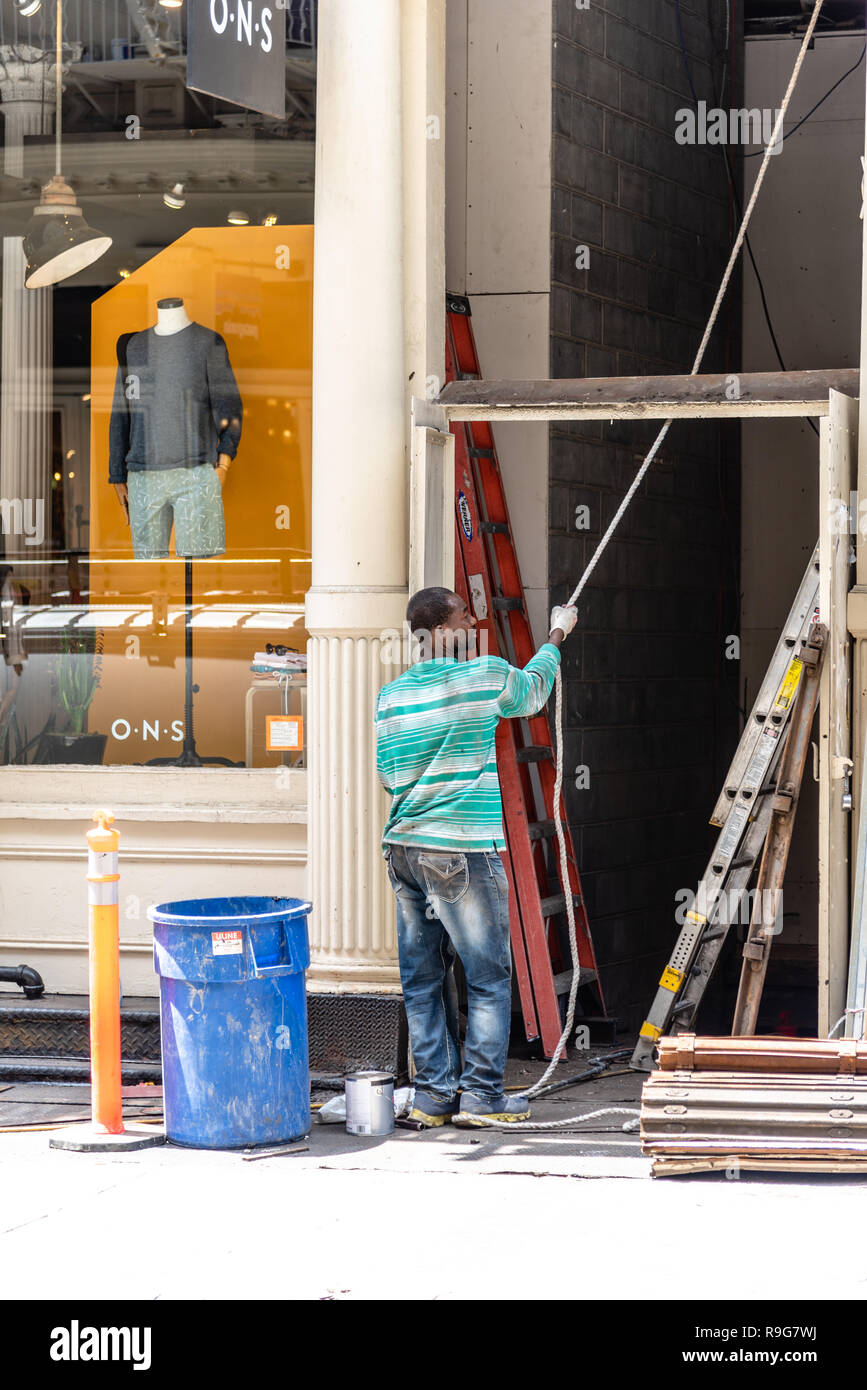 New York City, USA - June 25, 2018: Male construction worker working on ...