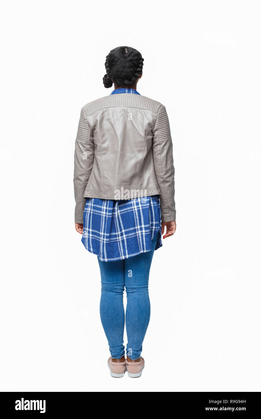 Back view of an African-American woman in a jacket. girl watching. Rear ...