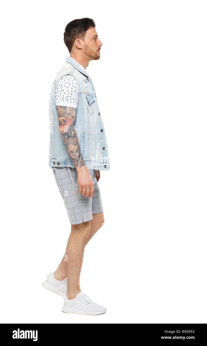 Back view of going handsome man in a shorts. walking young guy . Rear ...