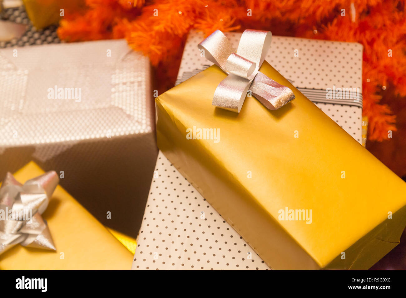 gold present boxes package with silver ribbons as holiday gift boxes ...