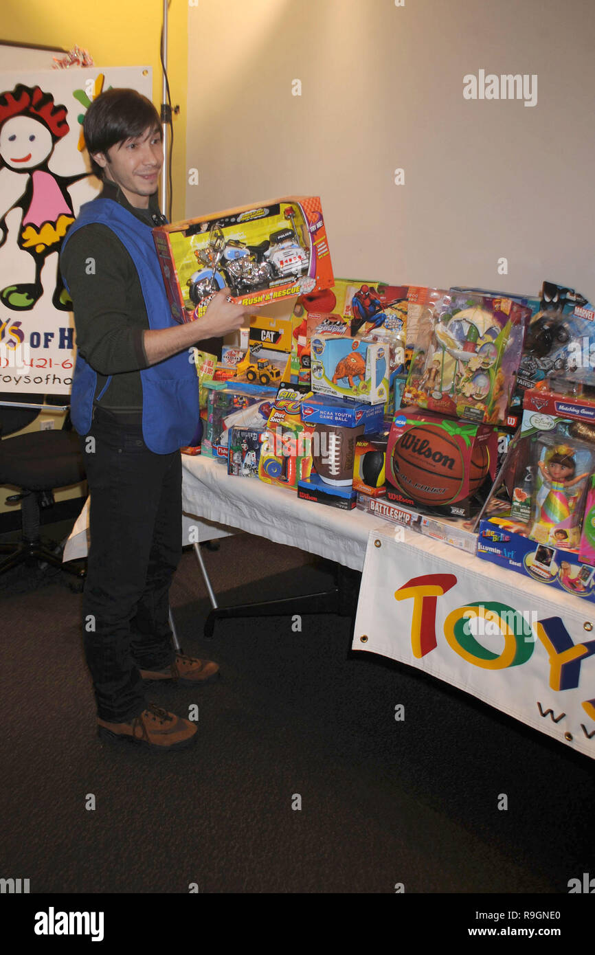 NEW YORK - DECEMBER 22: Actor Justin Long is seen distributing toys to ...
