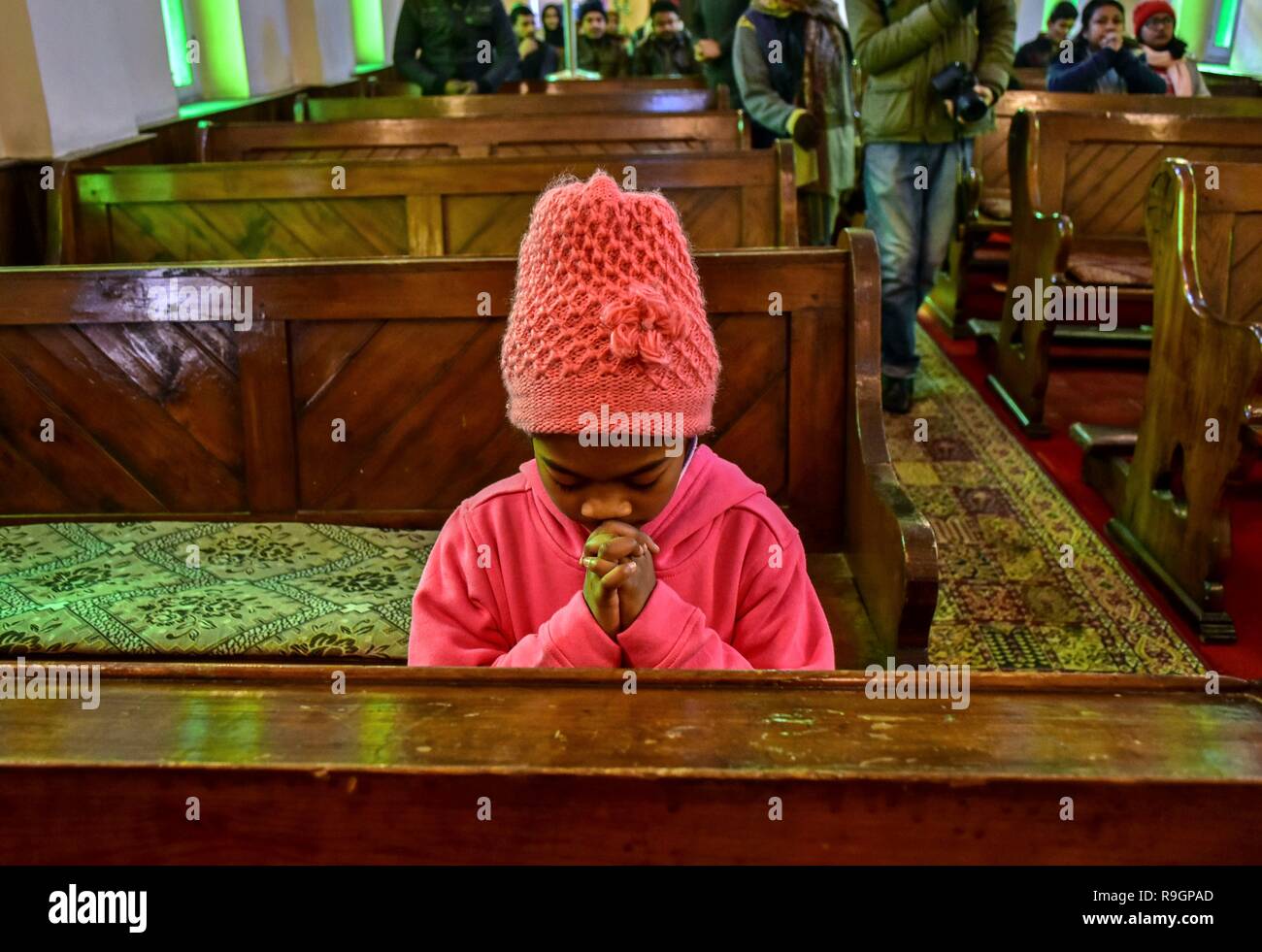 Child prays in church hi-res stock photography and images - Alamy