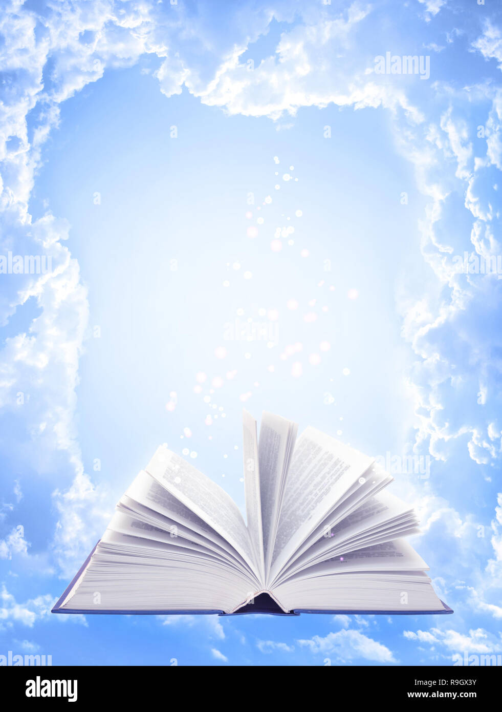 Magic book, blue sky and white clouds Stock Photo - Alamy