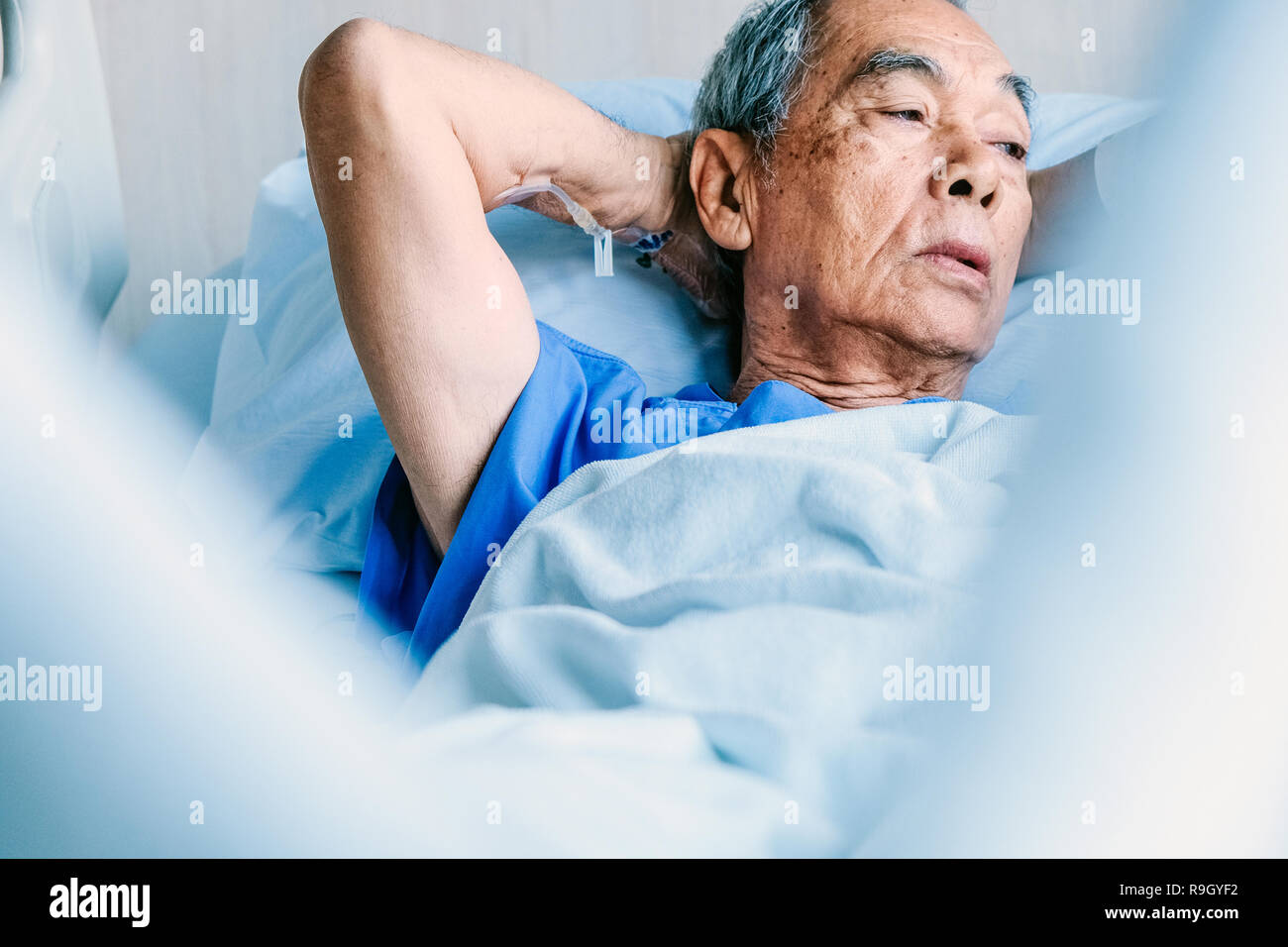 Elderly patients relax in hospital bed Stock Photo - Alamy