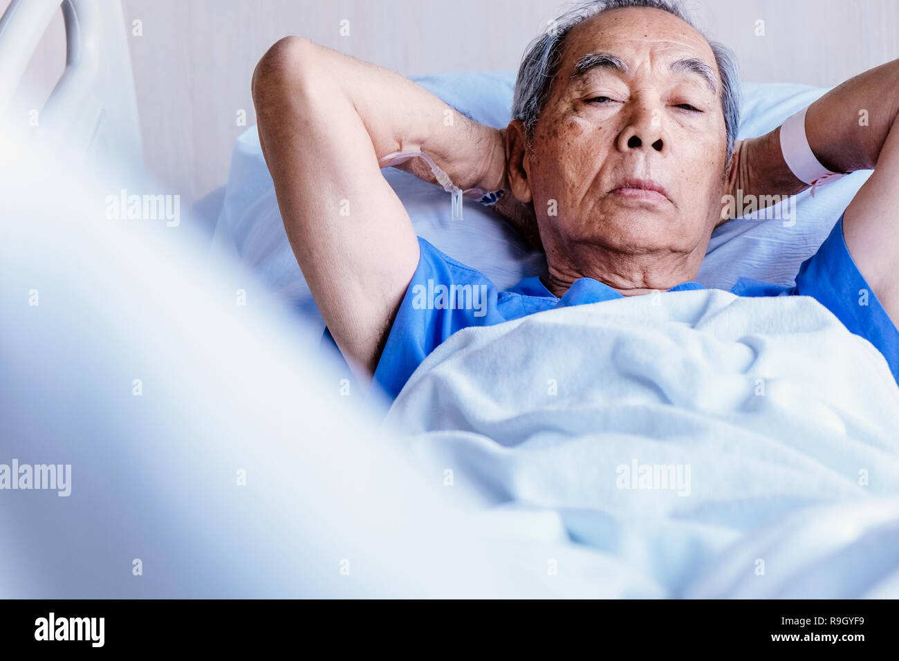 Elderly patients relax in hospital bed Stock Photo - Alamy