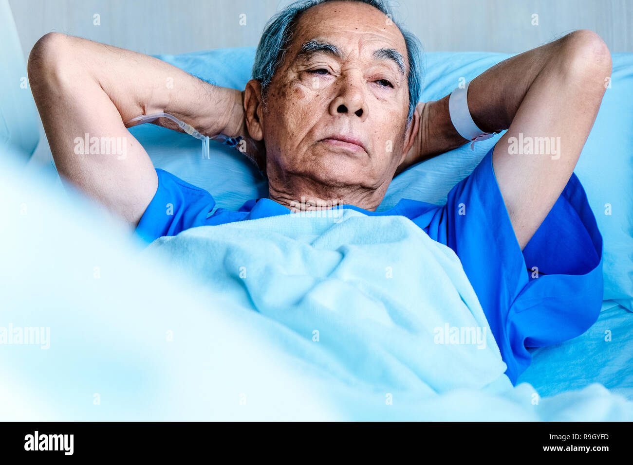 Elderly patients relax in hospital bed Stock Photo - Alamy
