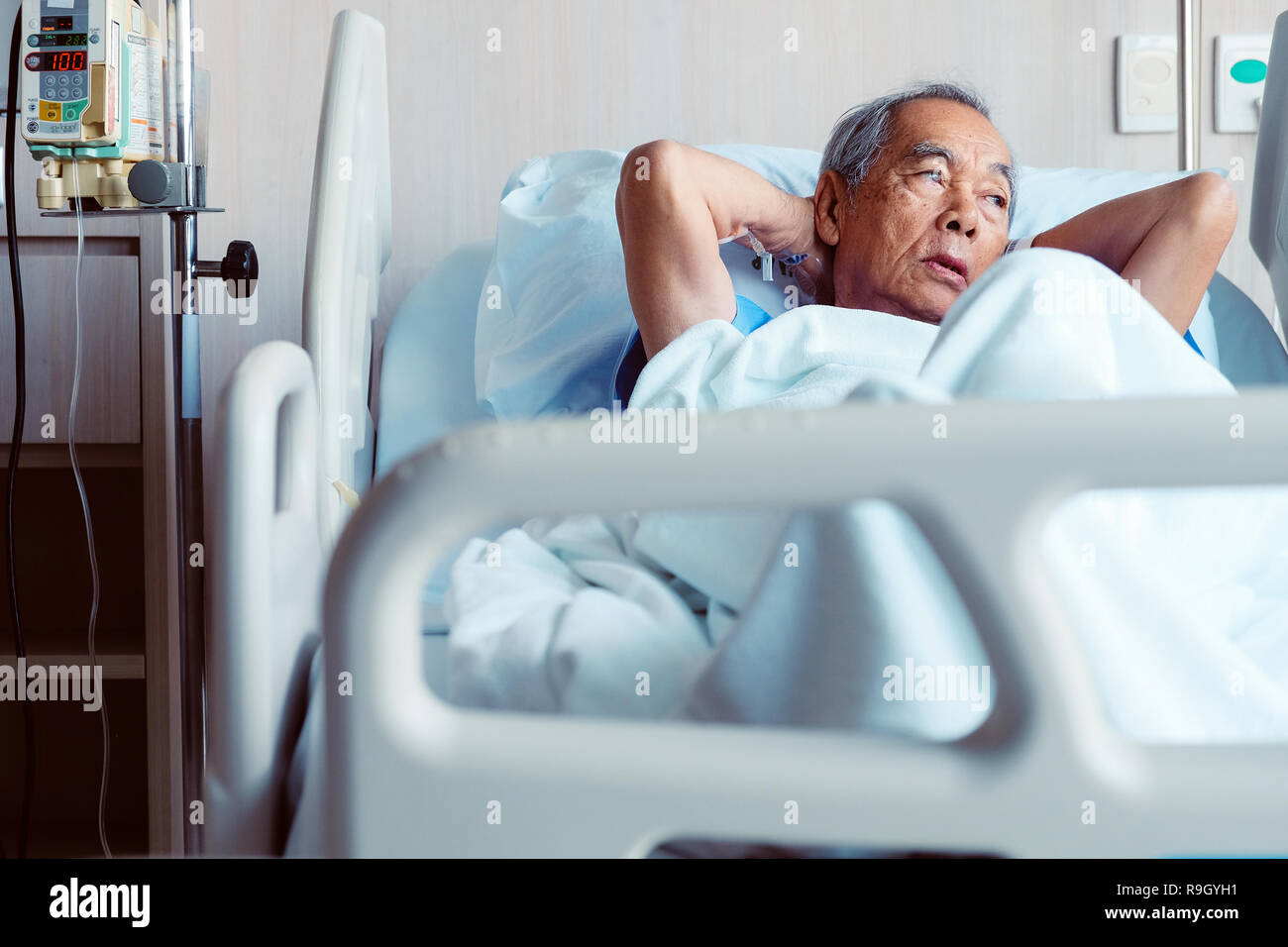 Elderly patients relax in hospital bed Stock Photo - Alamy