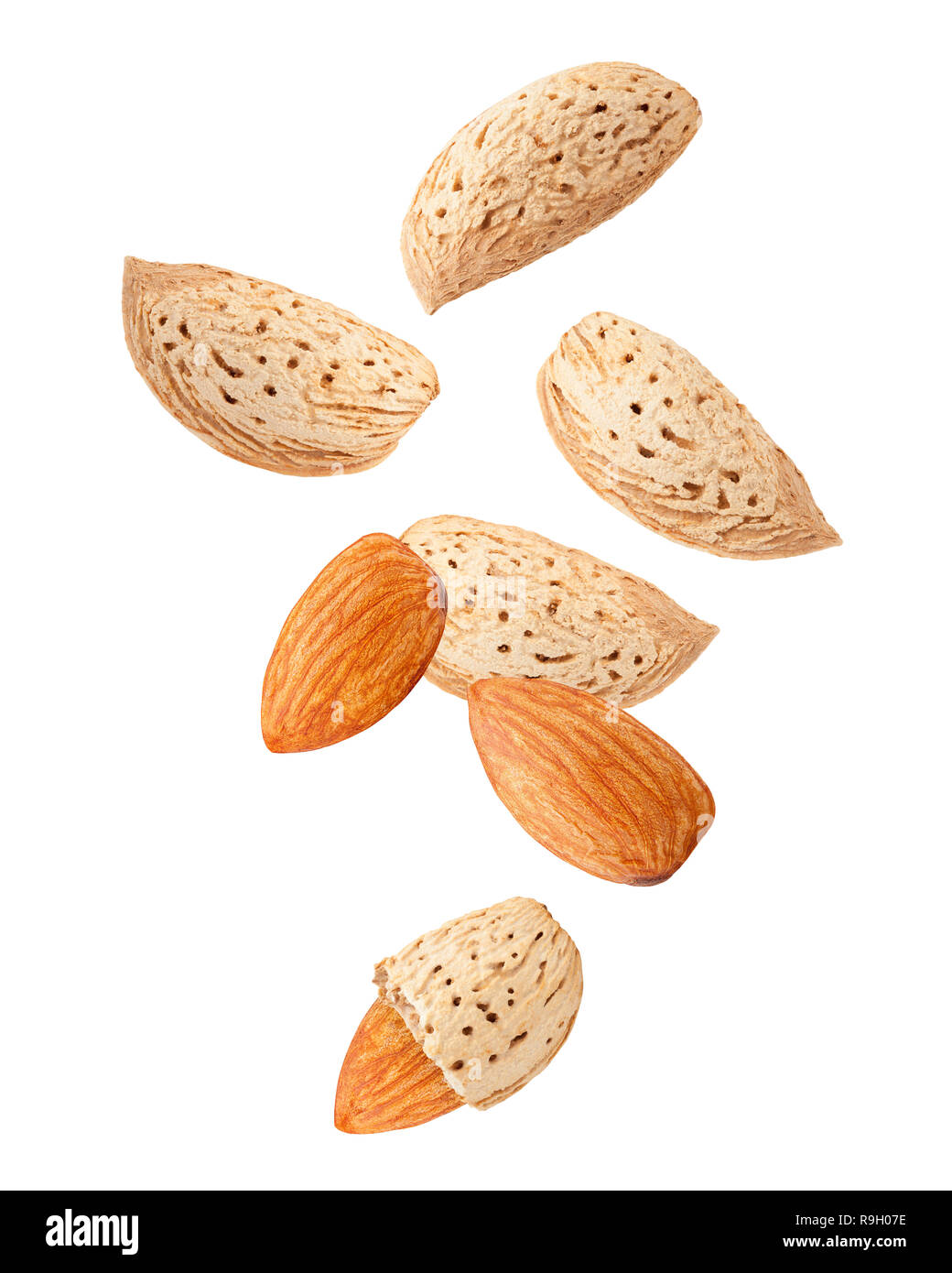 Falling Almond nut in shell isolated on white background, clipping path ...