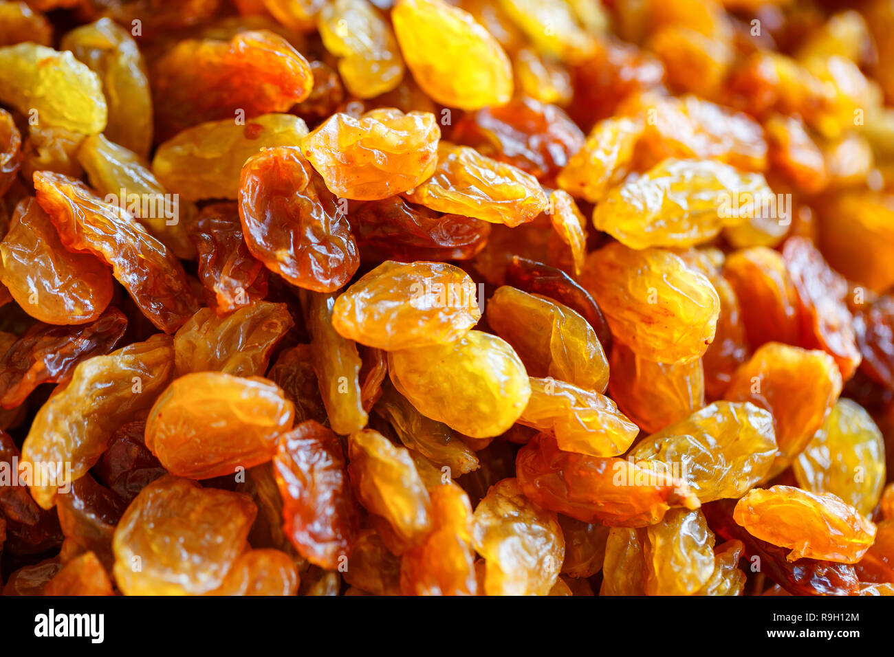 beautiful and useful yellow dried raisins close-up view from the top ...