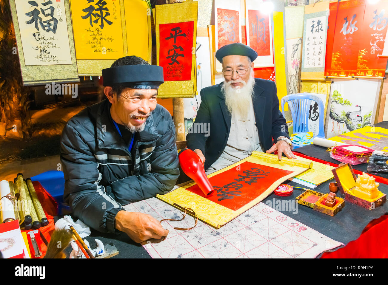 HANOI, VIETNAM, FEB 14, 2018: Old master is writing ancient letter for ...