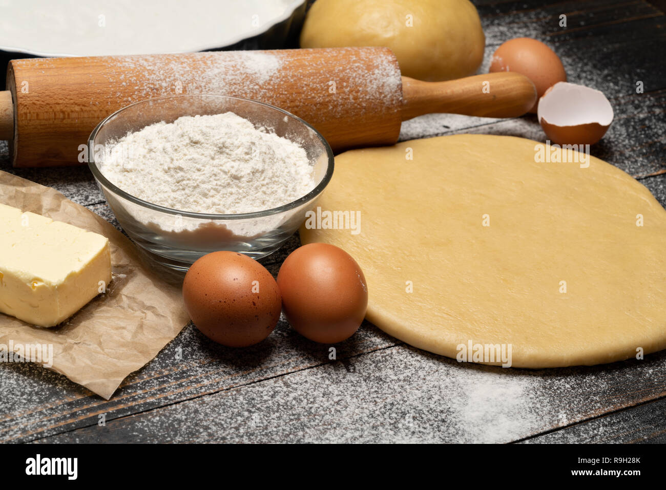 rolled and unbaked Shortcrust pastry dough recipe on wooden background ...