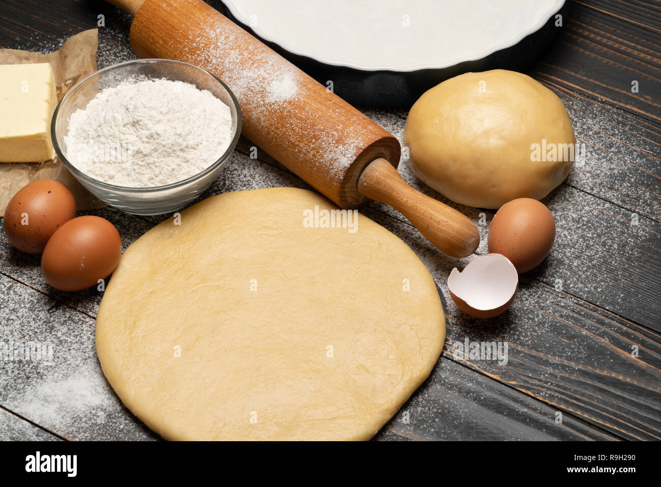 rolled and unbaked Shortcrust pastry dough recipe on wooden background ...