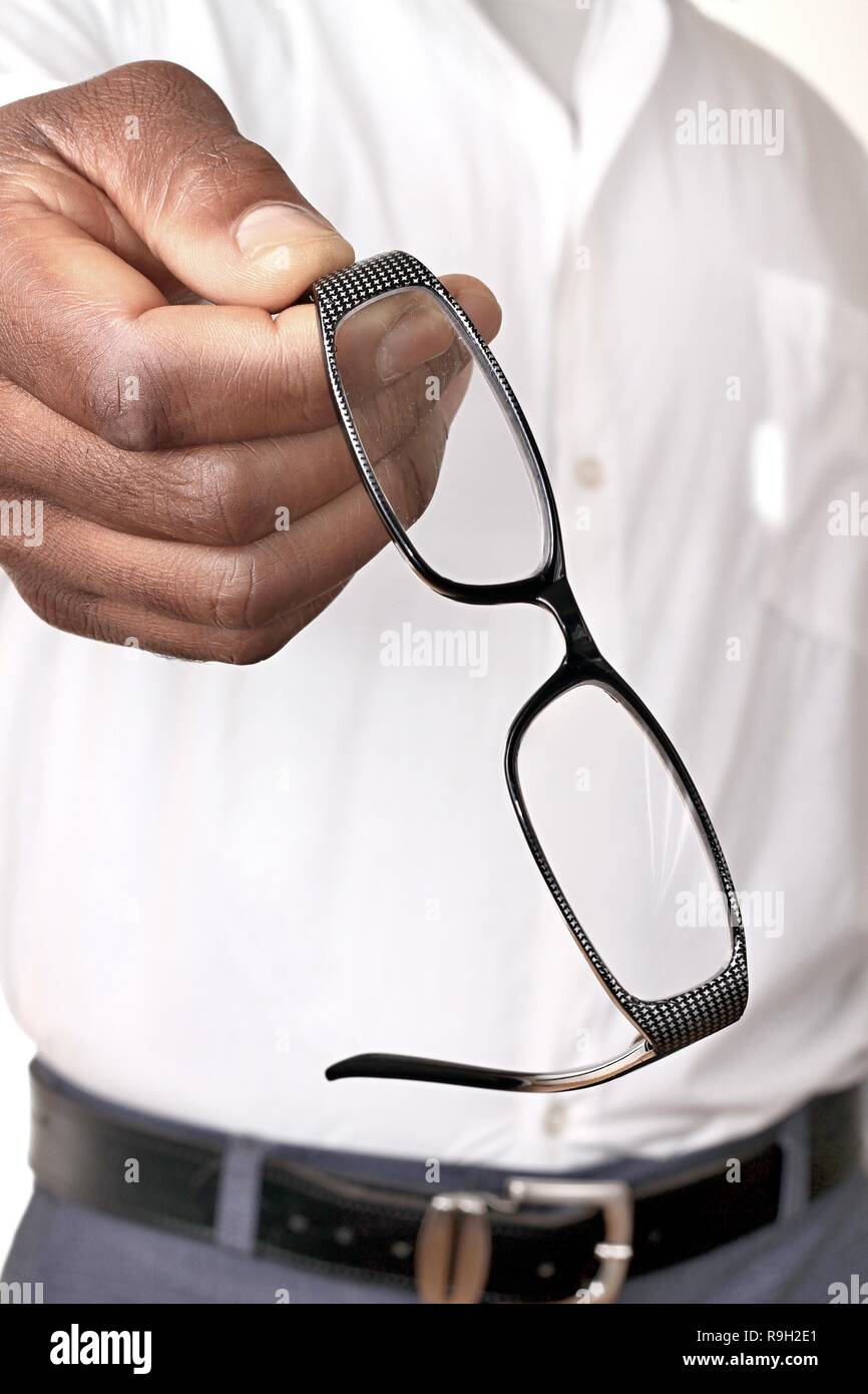 hand holding glasses on white background stock photo Stock Photo - Alamy