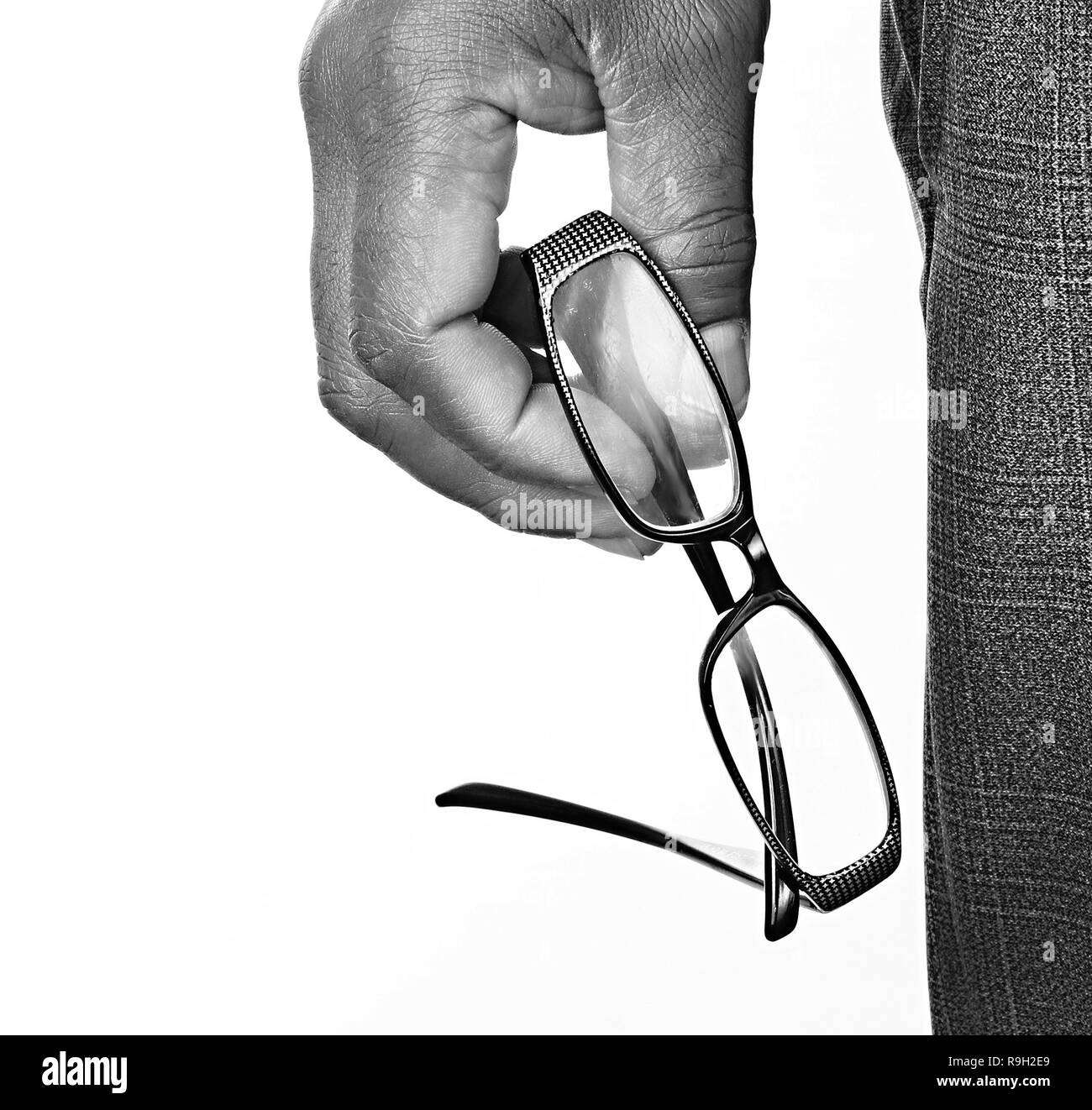 hand holding glasses on white background stock photo Stock Photo - Alamy