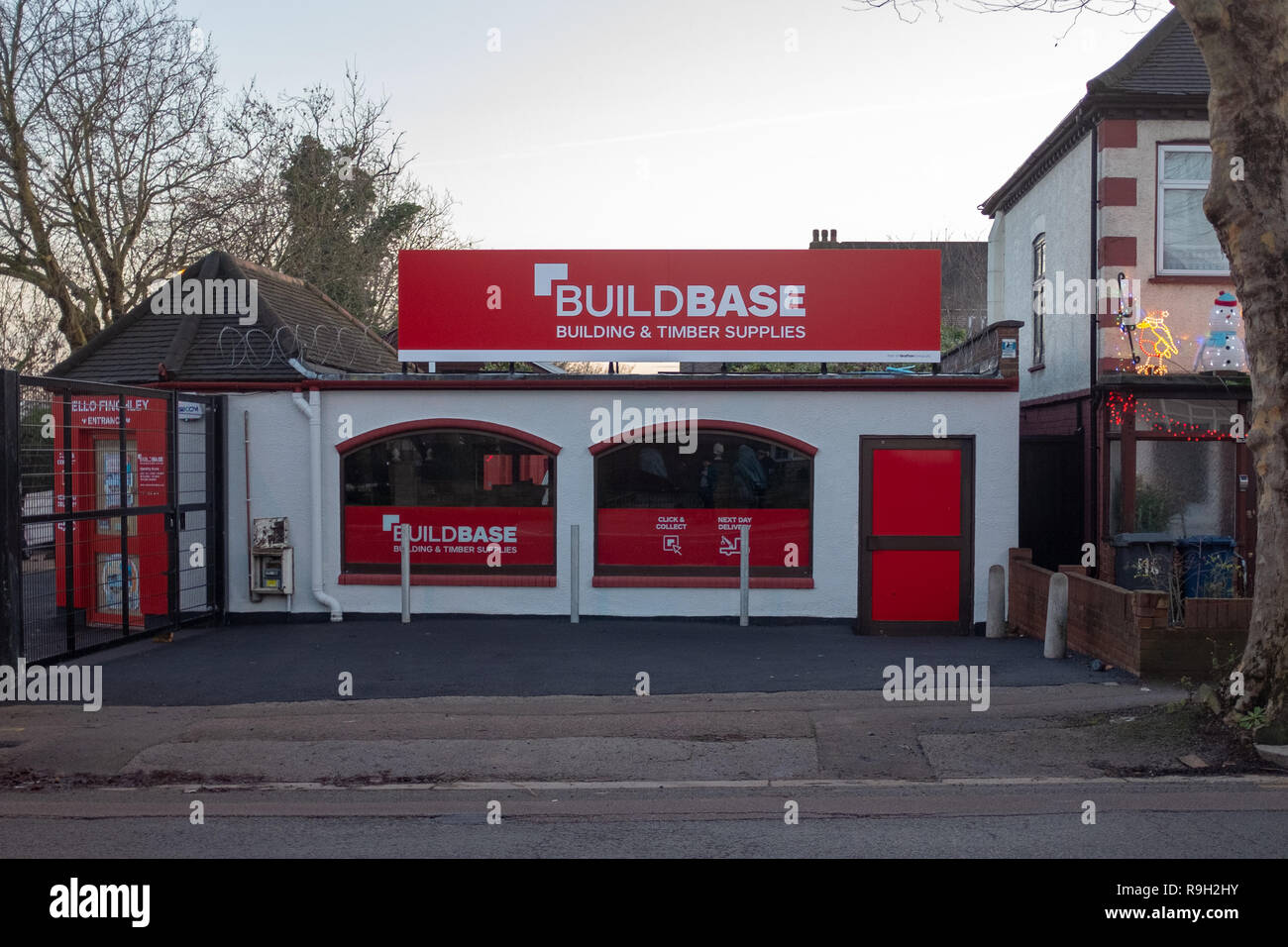 Finchley, UK, 24 Dec 2018: The front of a new Buildbase building and ...