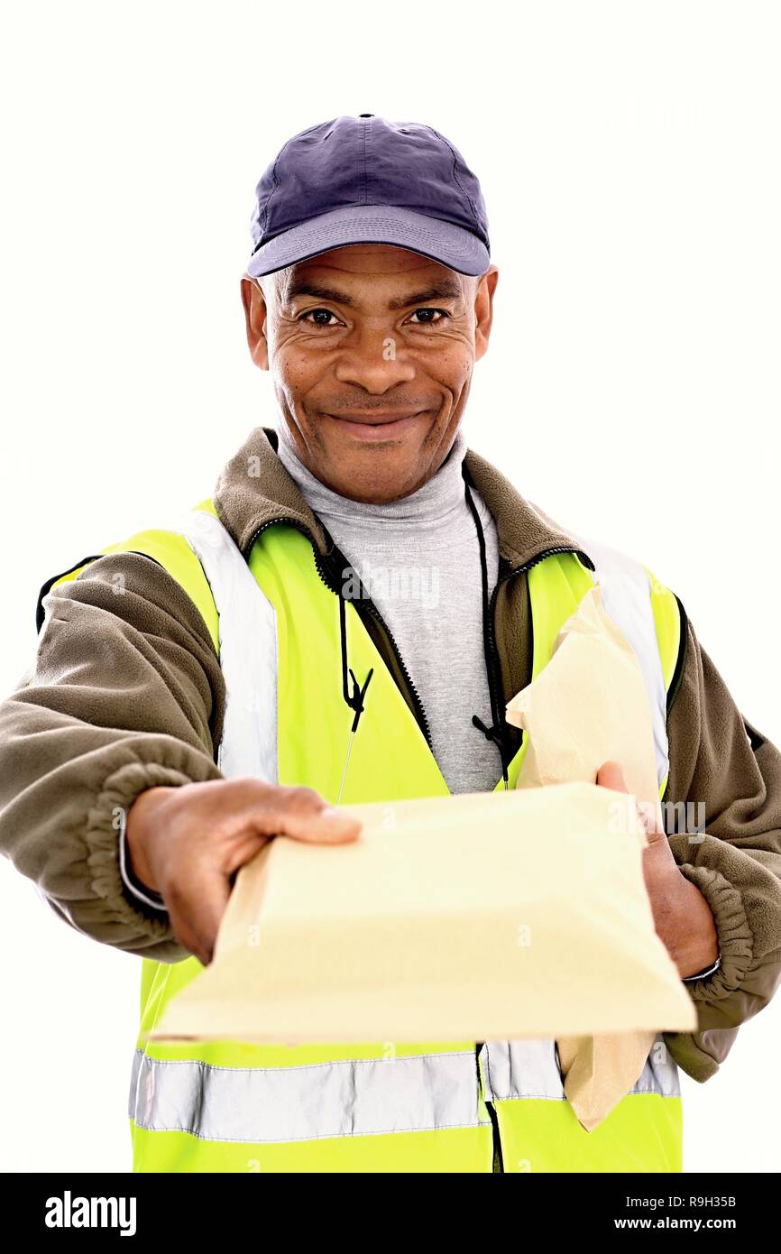 delivery man delivering parcel stock photo Stock Photo - Alamy