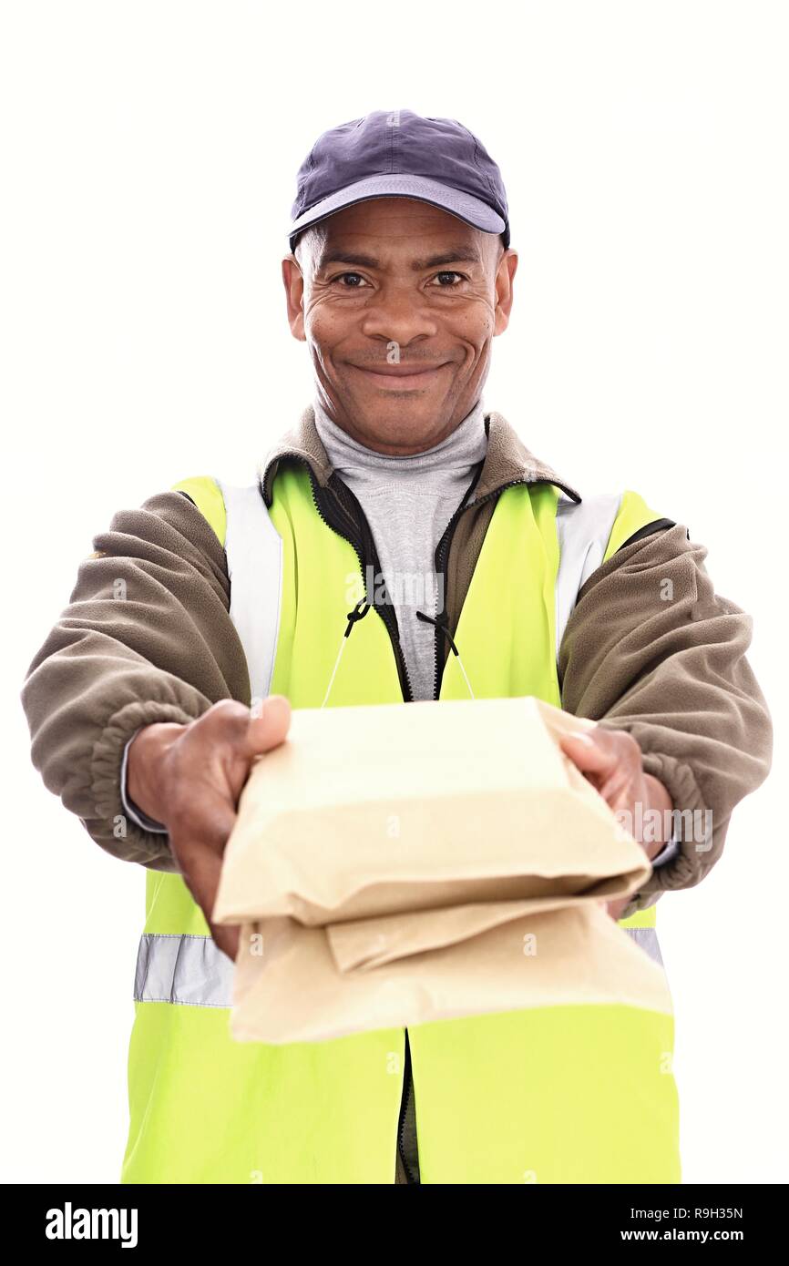 delivery man delivering parcel stock photo Stock Photo - Alamy