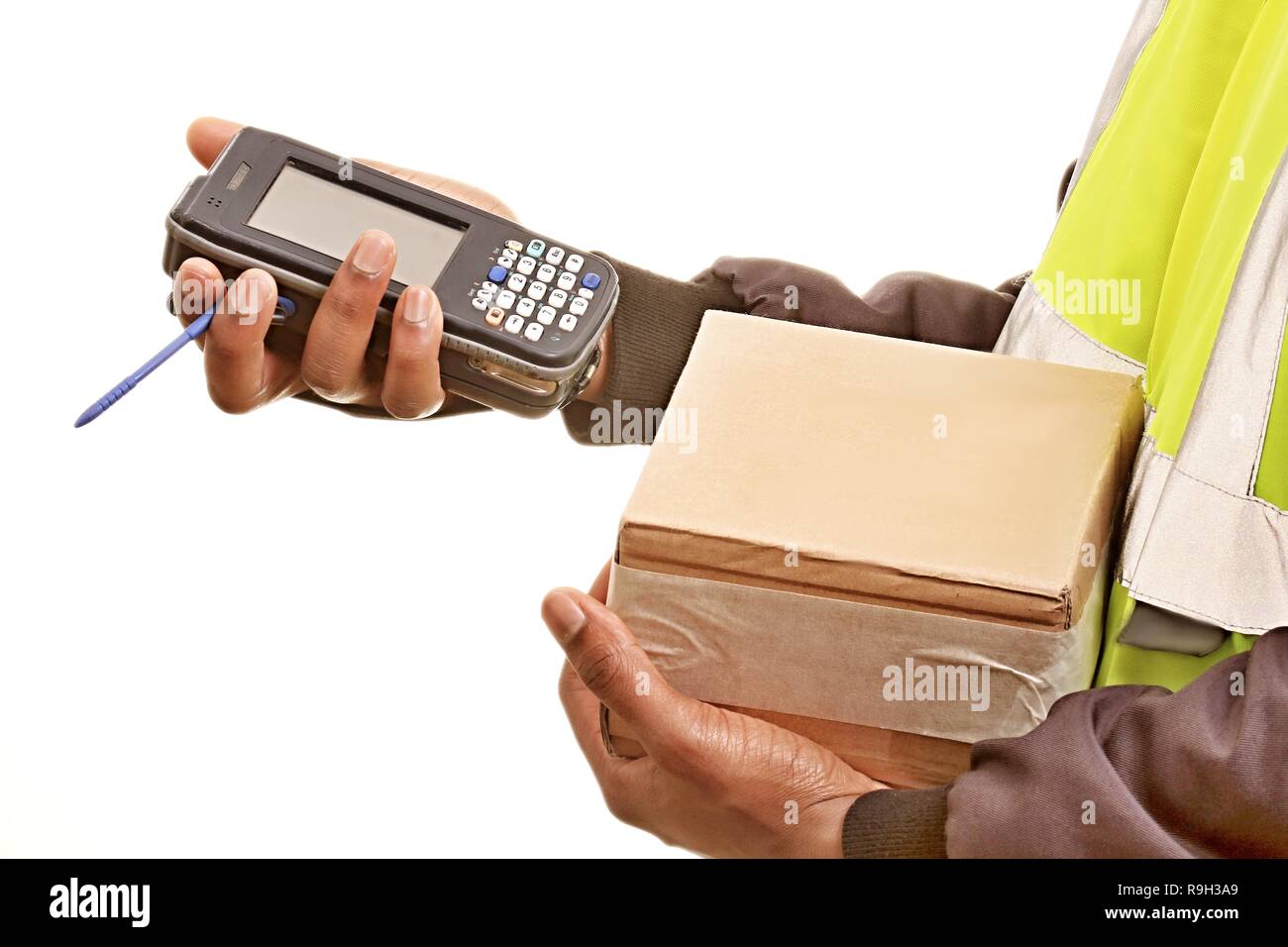 delivery man with a parcel for customer to sign stock photo Stock Photo ...