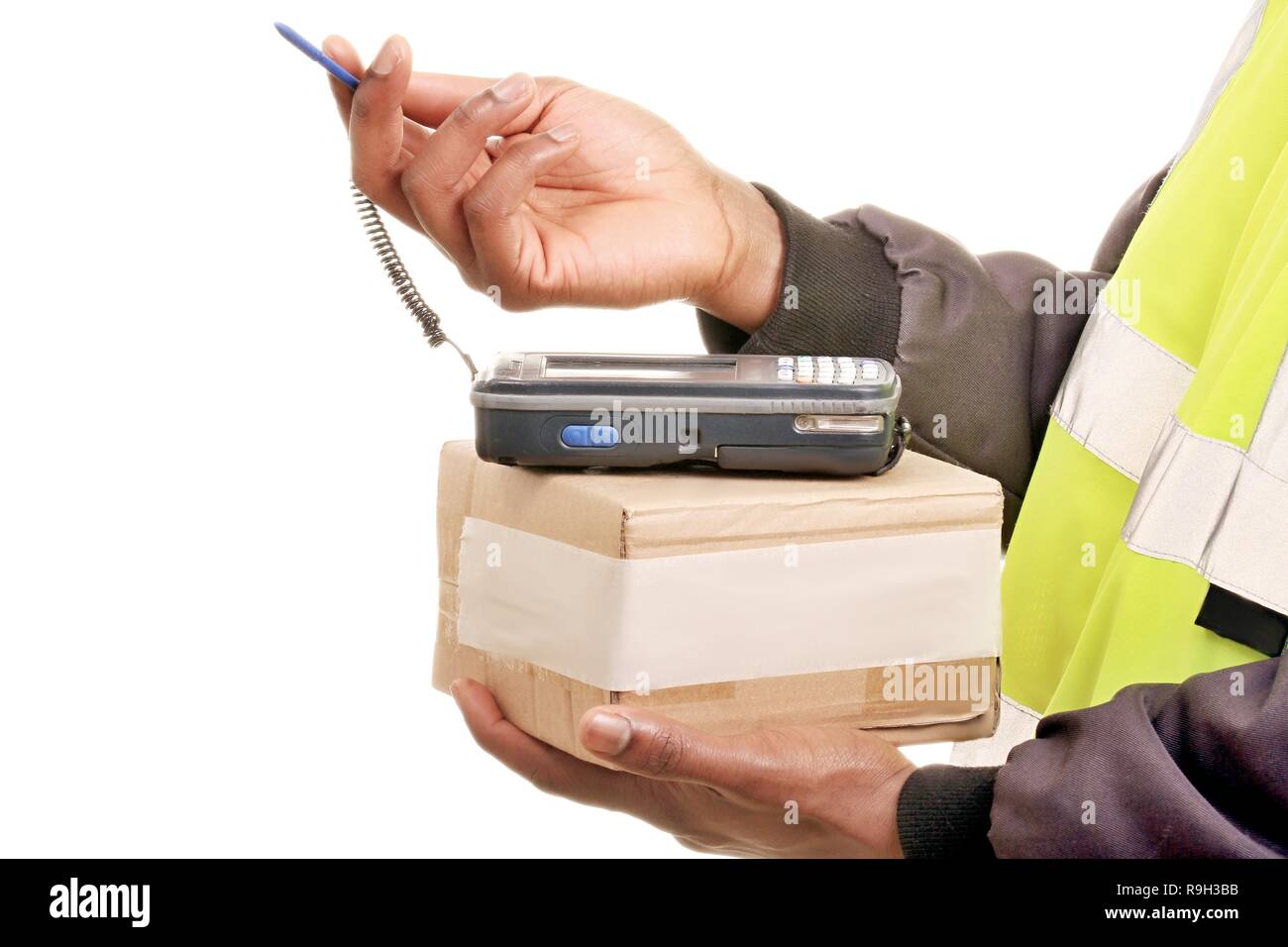 delivery man with a parcel for customer to sign stock photo Stock Photo ...