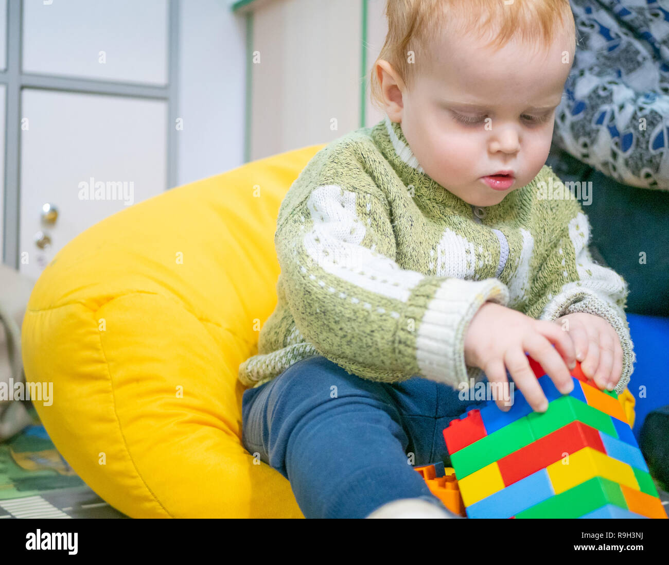 Baby boy stacking blocks hi-res stock photography and images - Alamy
