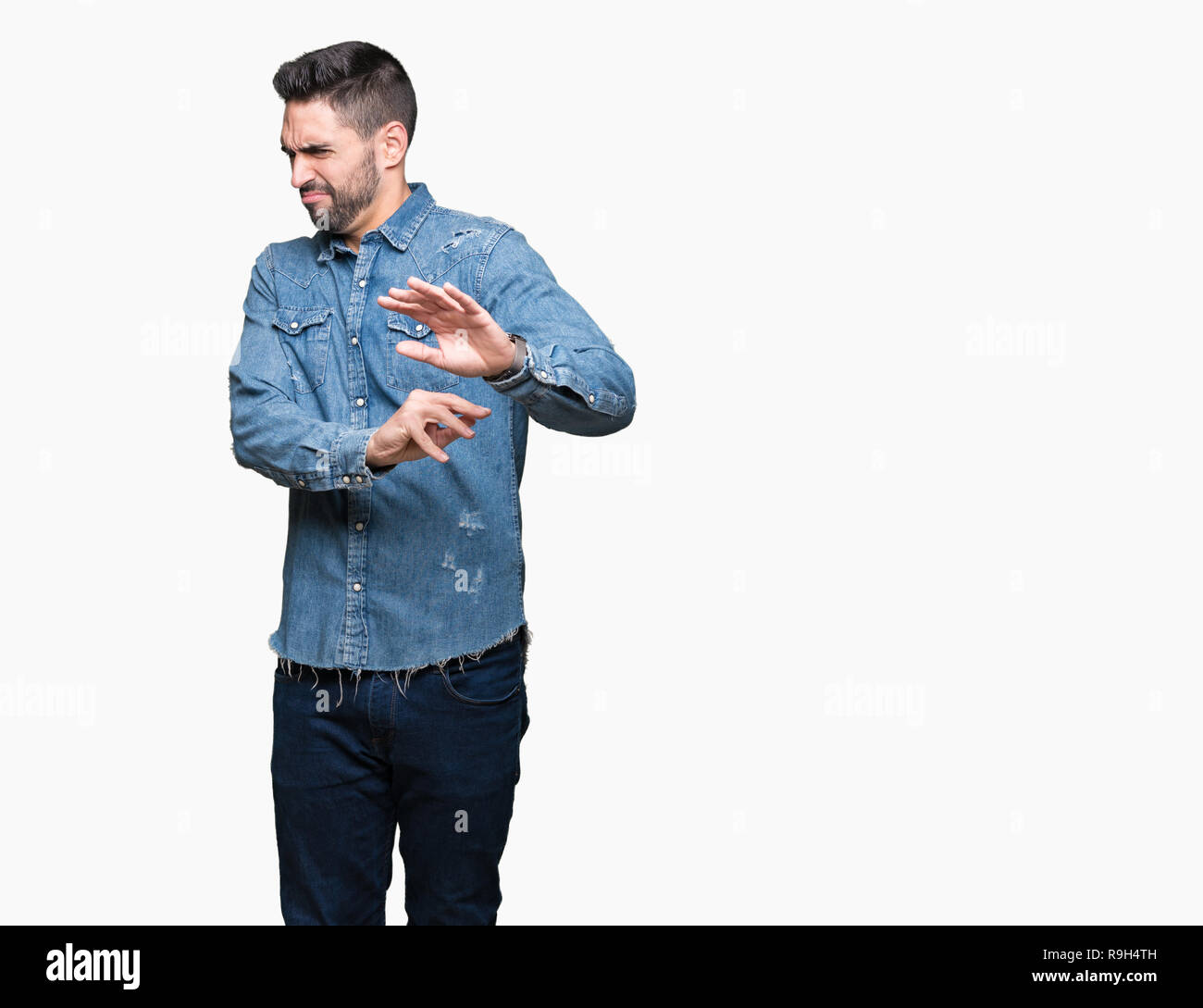Young handsome man over isolated background disgusted expression ...