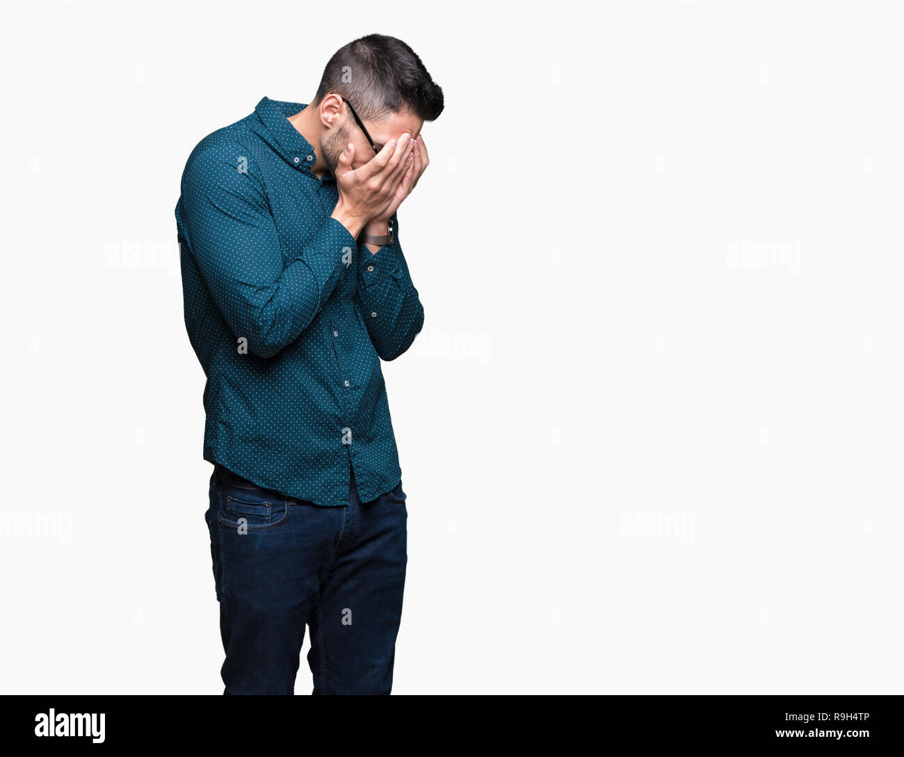 Young handsome business man wearing glasses over isolated background ...