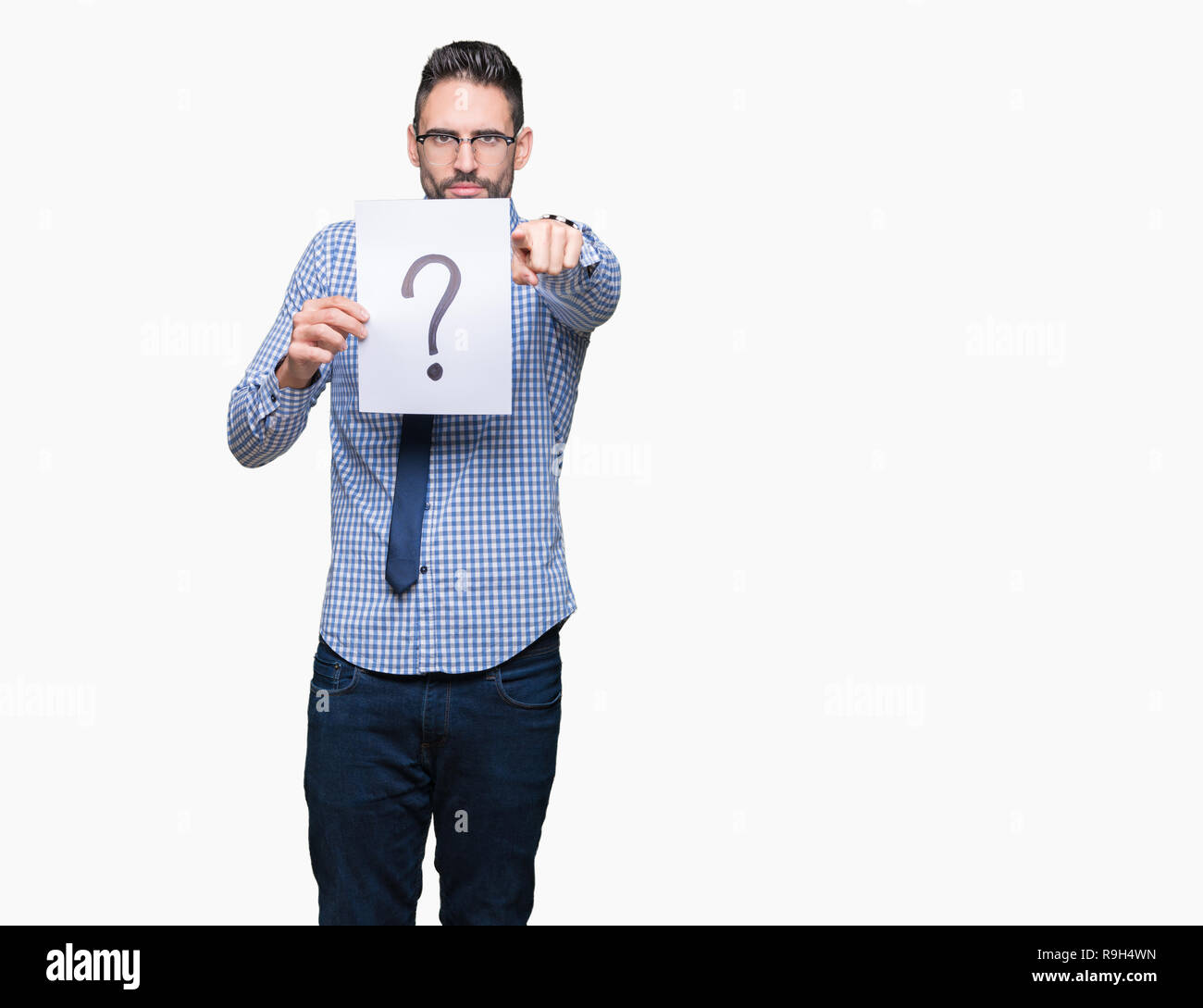 Handsome young business man holding paper with question mark over ...