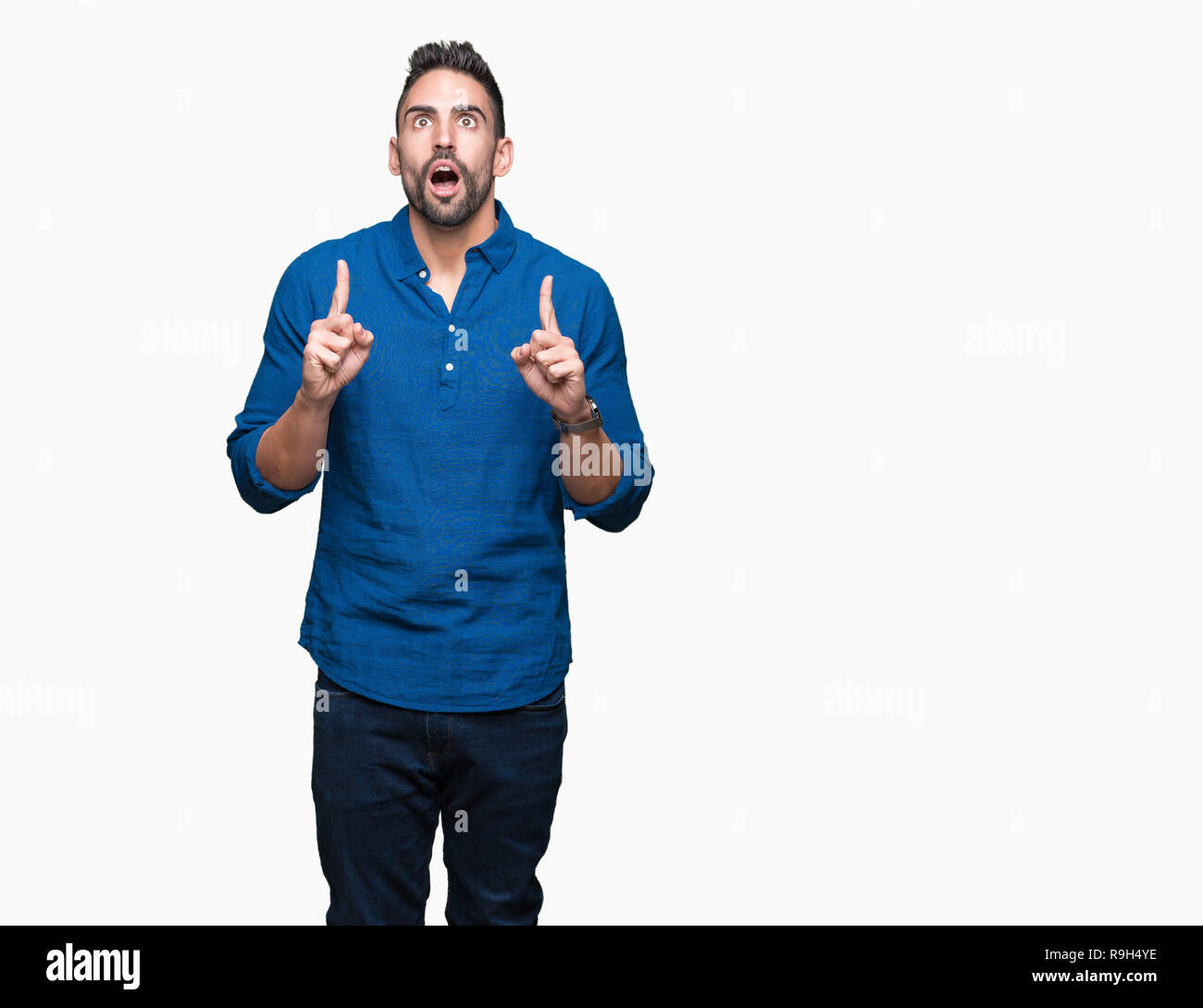 Young handsome man over isolated background amazed and surprised ...