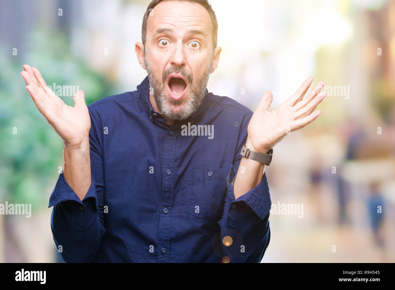 Middle age hoary senior man over isolated background clueless and ...