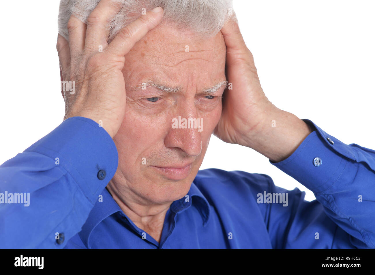 Close up portrait of sad senior man with headache isolated on white ...