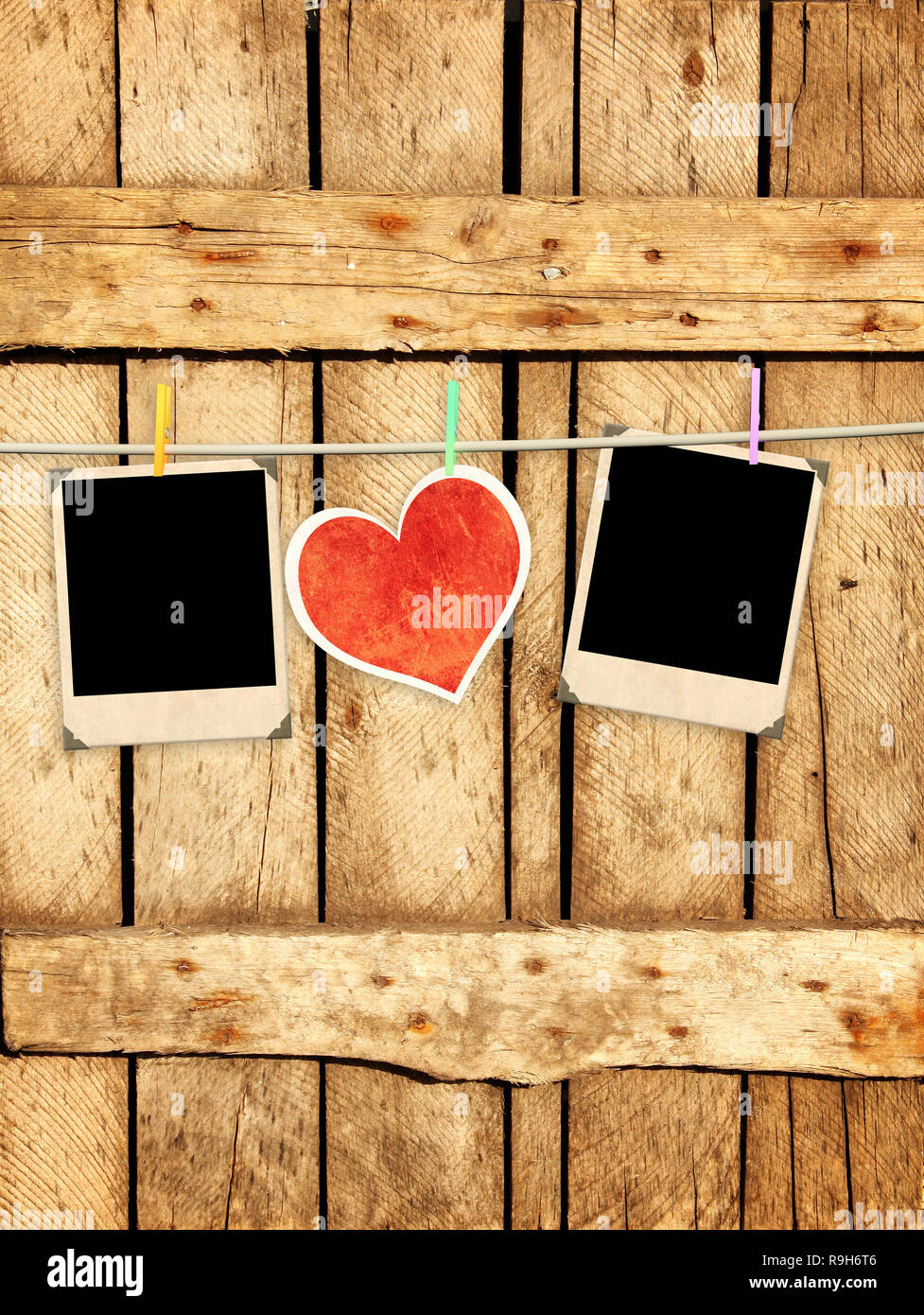 Old photos and paper heart on wood texture Stock Photo - Alamy