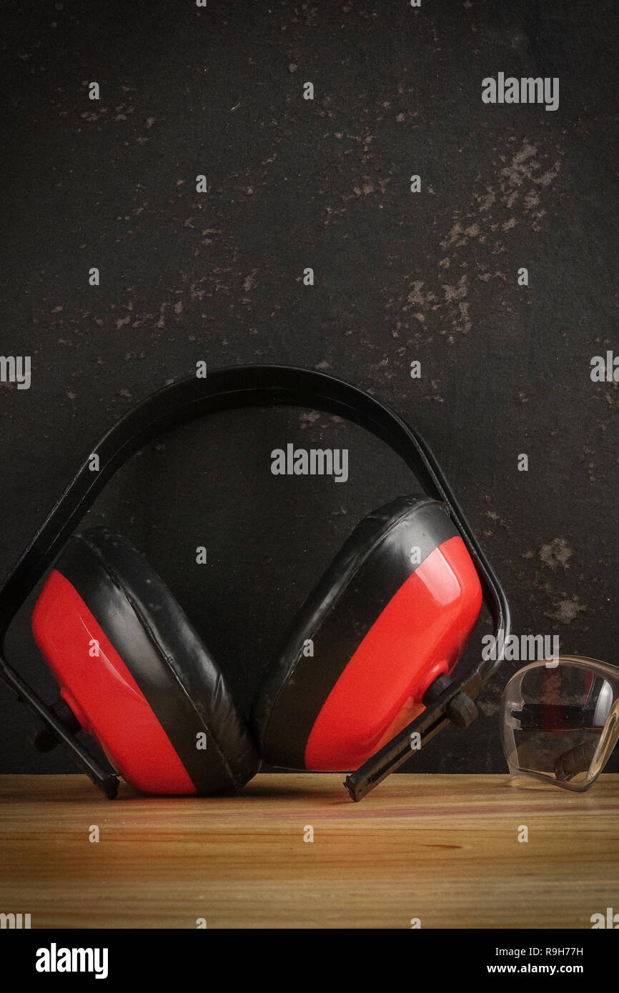 Safety Personal Protective Equipment(PPE) on a rustic black background ...