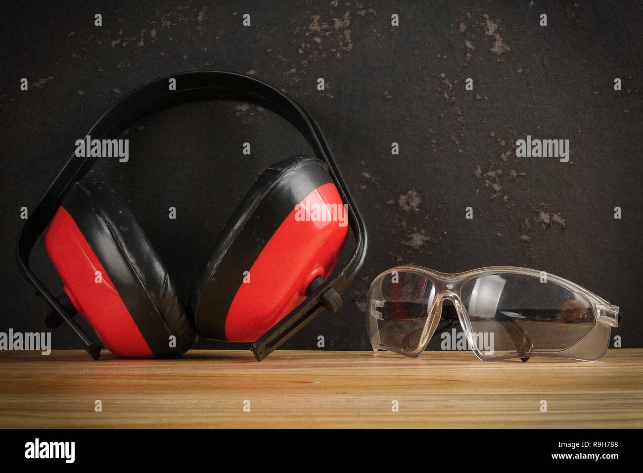 Safety Personal Protective Equipment(PPE) on a rustic black background ...