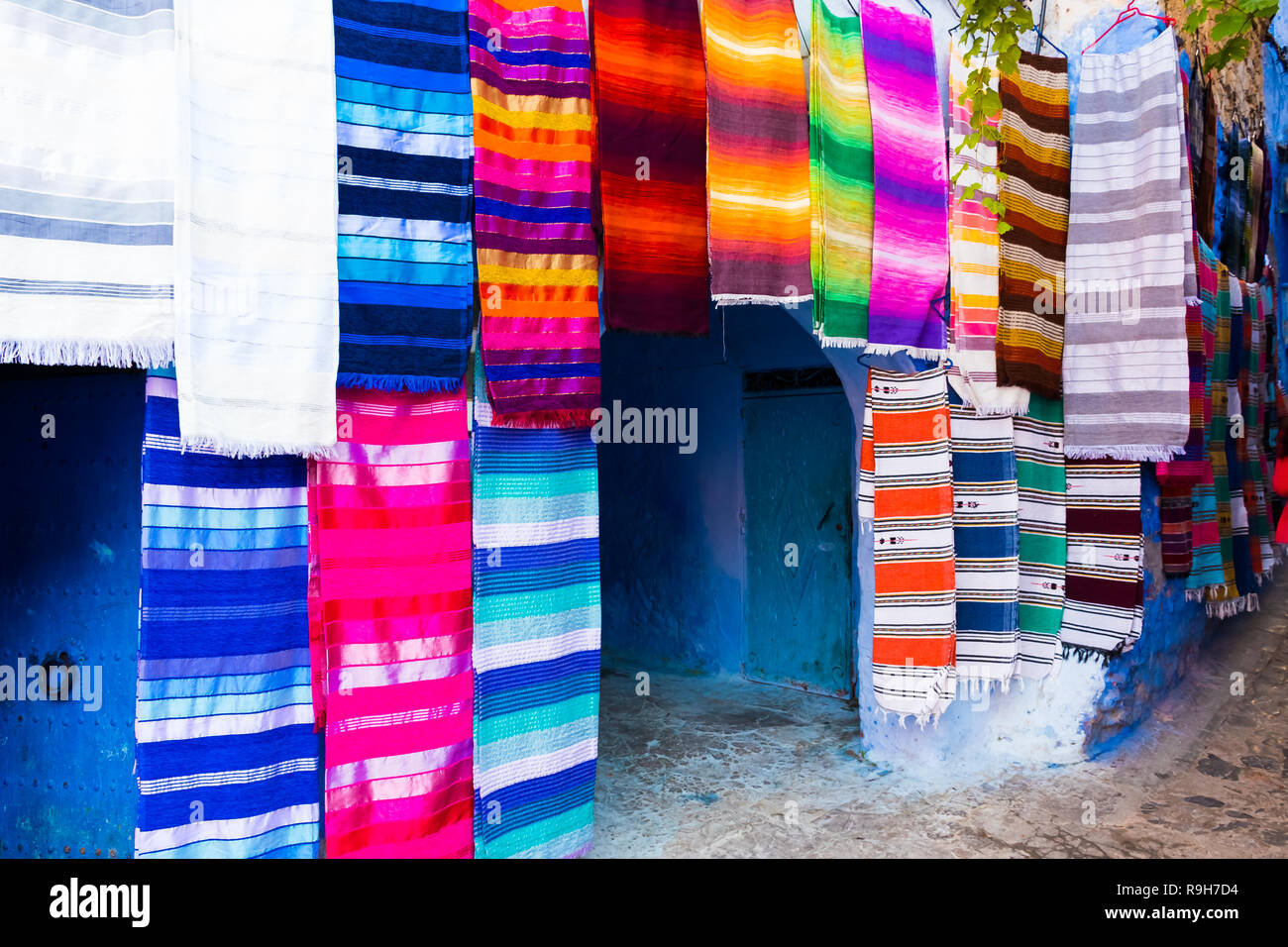 Street market with rugs or carpets in blue medina of city Chefchaouen ...