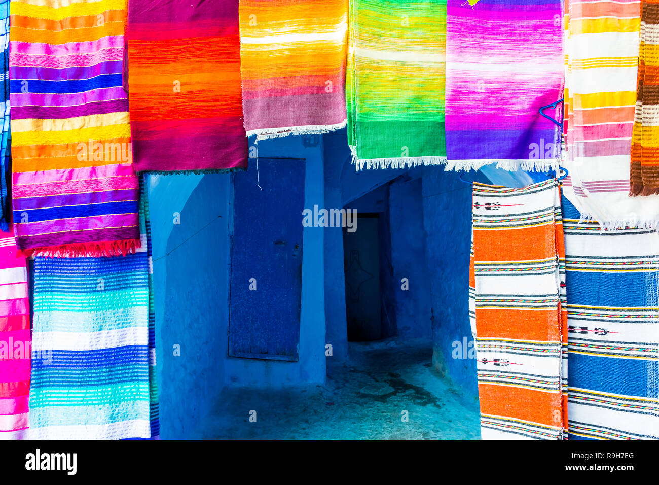 Street market with rugs or carpets in blue medina of city Chefchaouen ...
