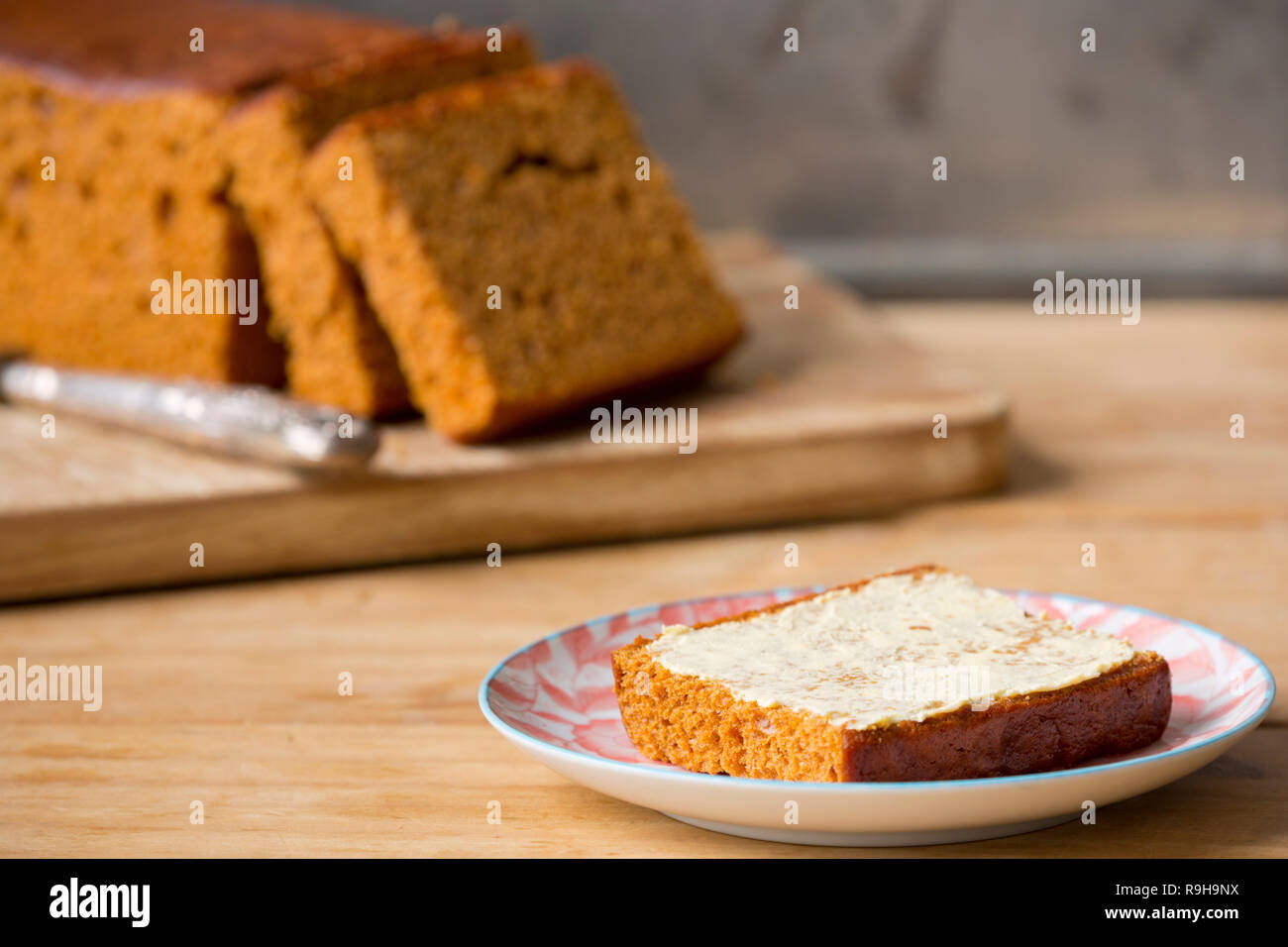 Slices of 'ontbijtkoek', traditional Dutch spice bread, with butter ...