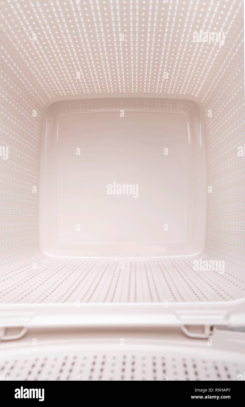 Empty plastic laundry basket with the lid open. Isolated on white ...