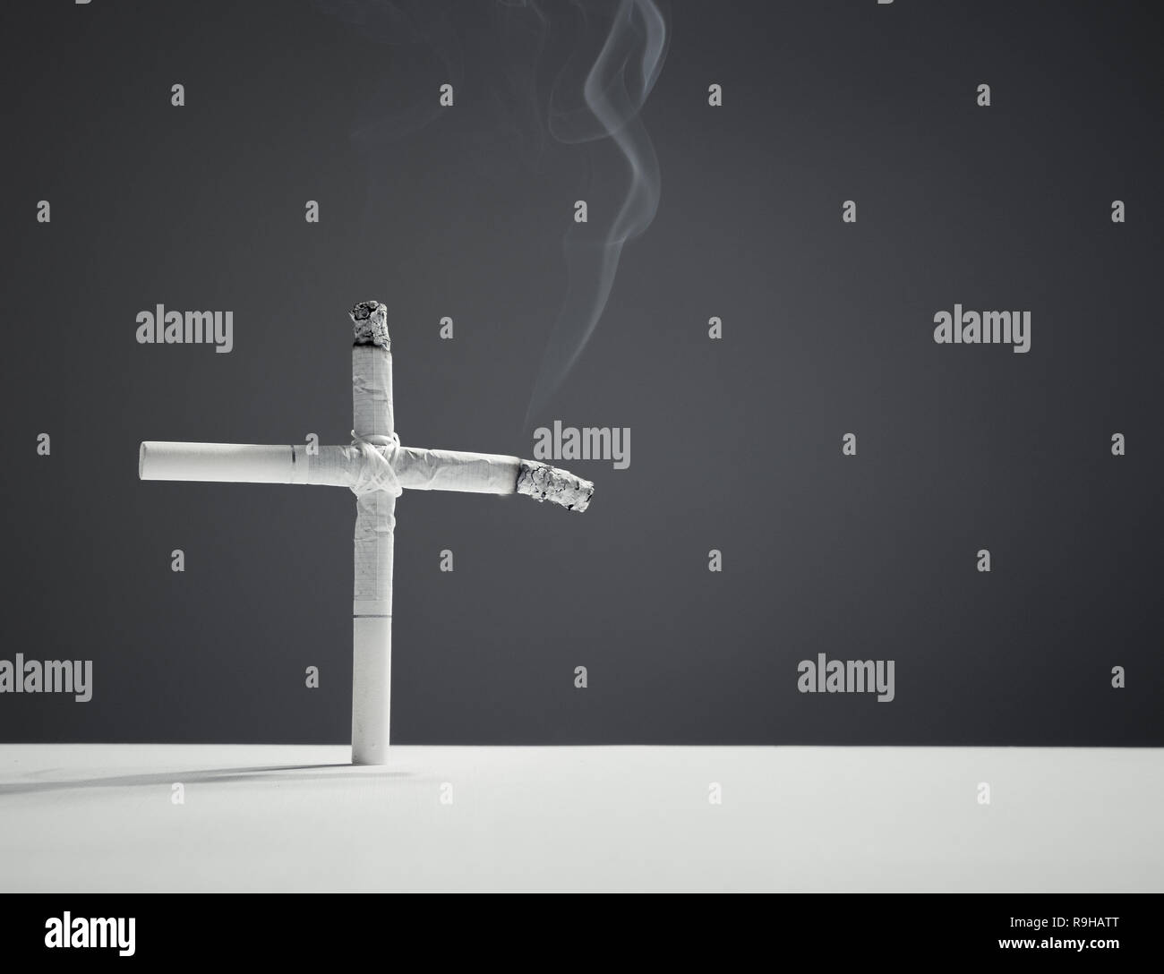 Smoking kills concept image with cross made from lit cigarettes Stock ...