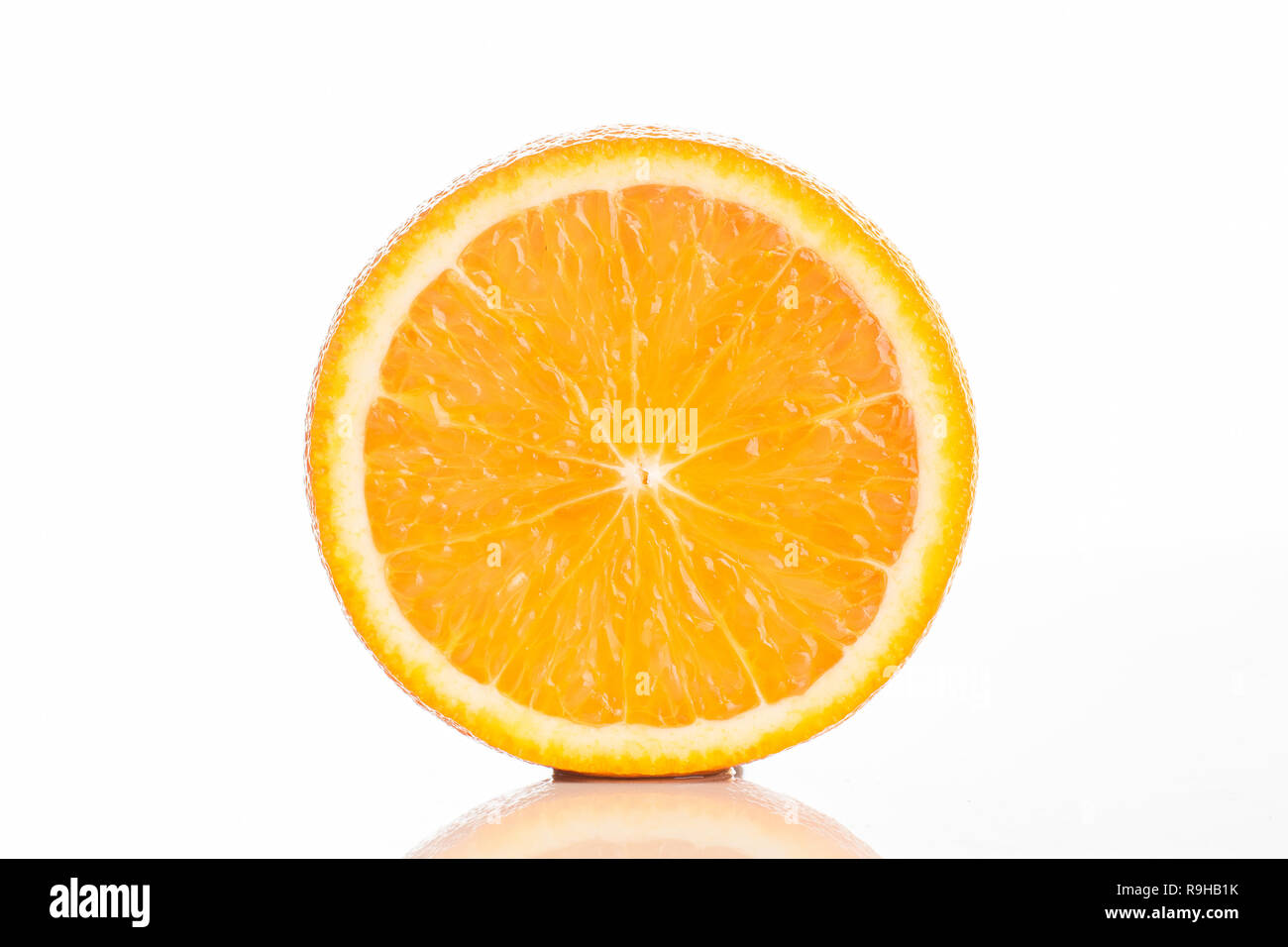 Close up of cut in half orange isolated on white background Stock Photo ...