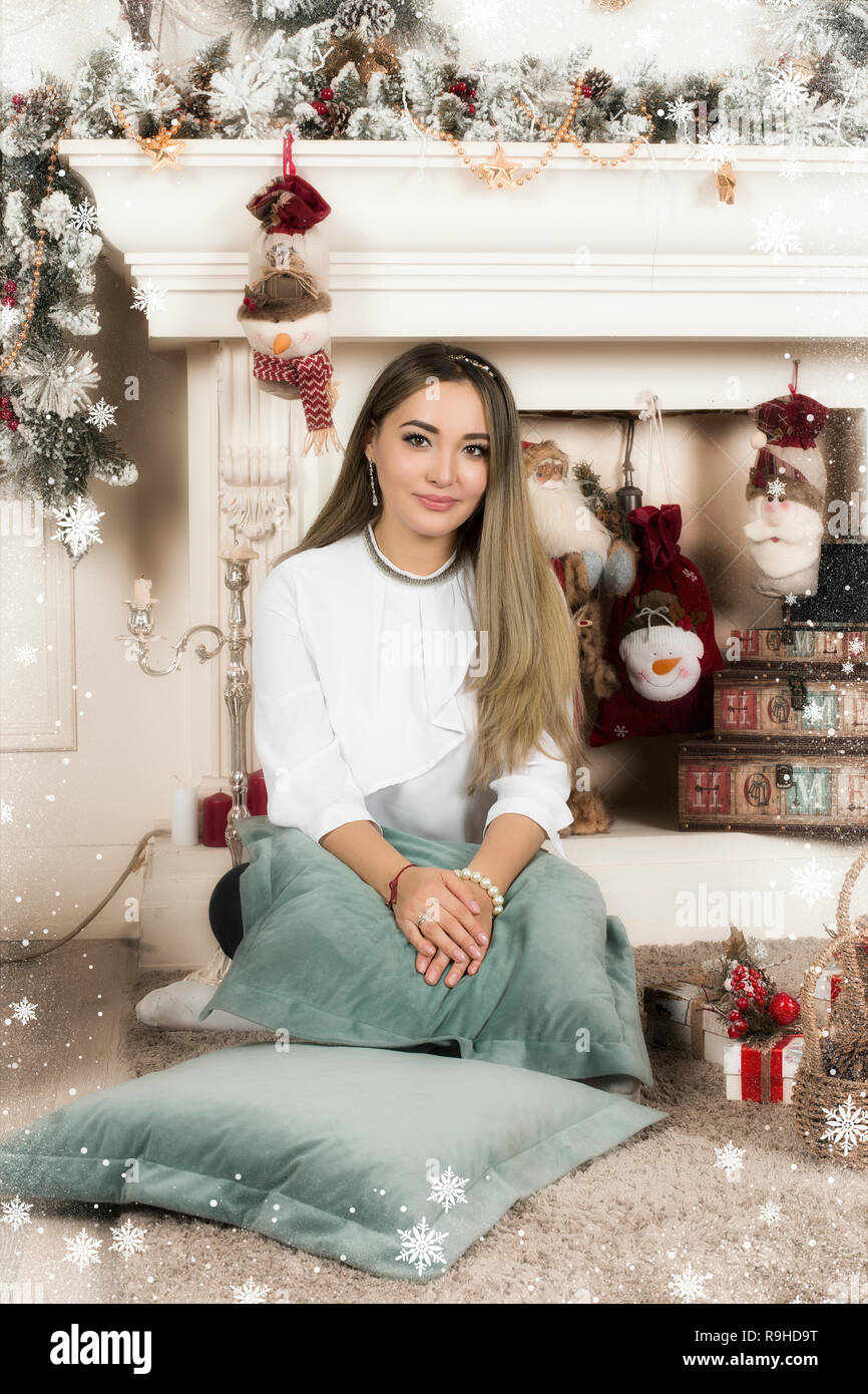 Beautiful asian woman under christmas tree. New year presents Stock ...
