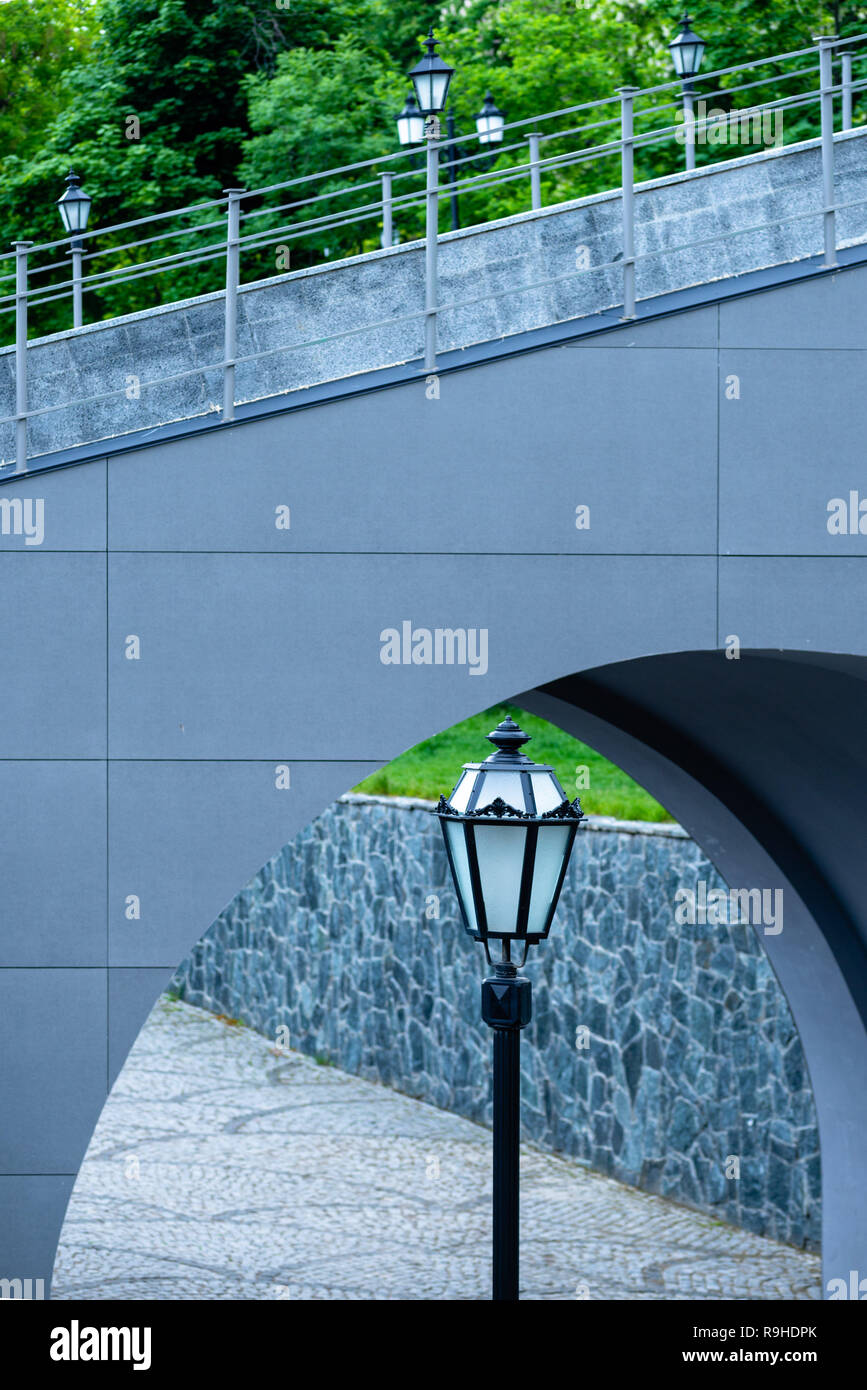 Street vintage lantern on the background of the arch of the bridge ...