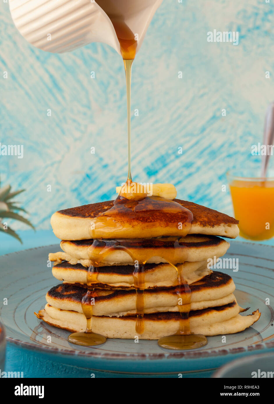 Pancakes stack pouring marple syrup. Little jug. Breakfast. Jem, Papaya ...