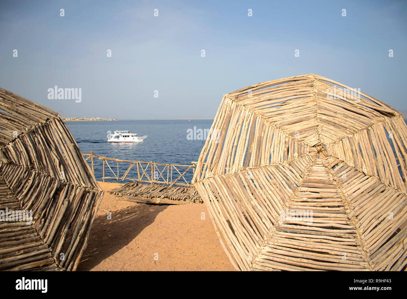 vacation in exotic countries. Wooden umbrellas lined up in the ...