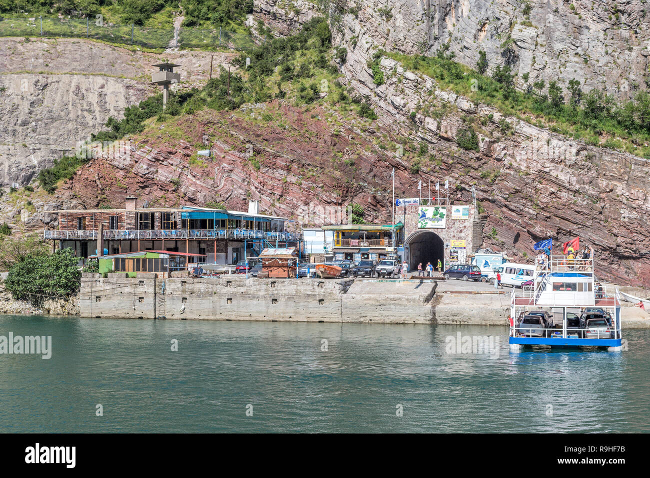 Views tunnel entrance to and Lake Koman Ferry, Albania Stock Photo - Alamy