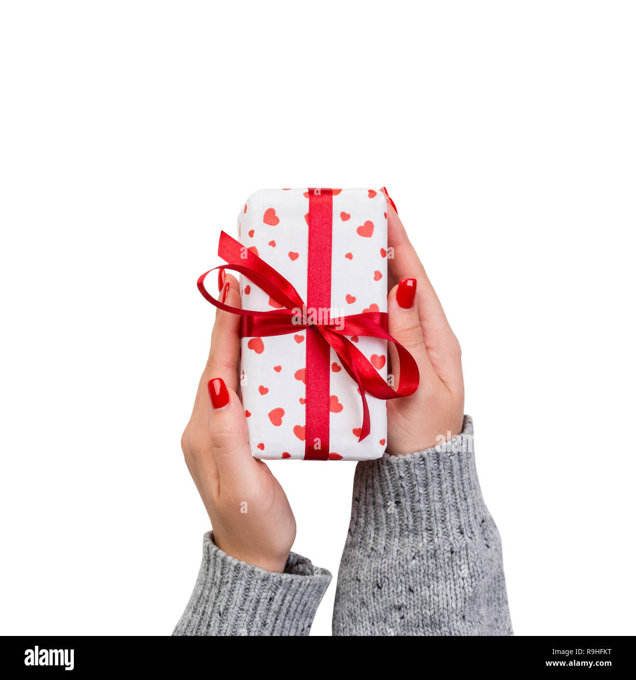 Woman hands give wrapped valentine or other holiday handmade present in ...